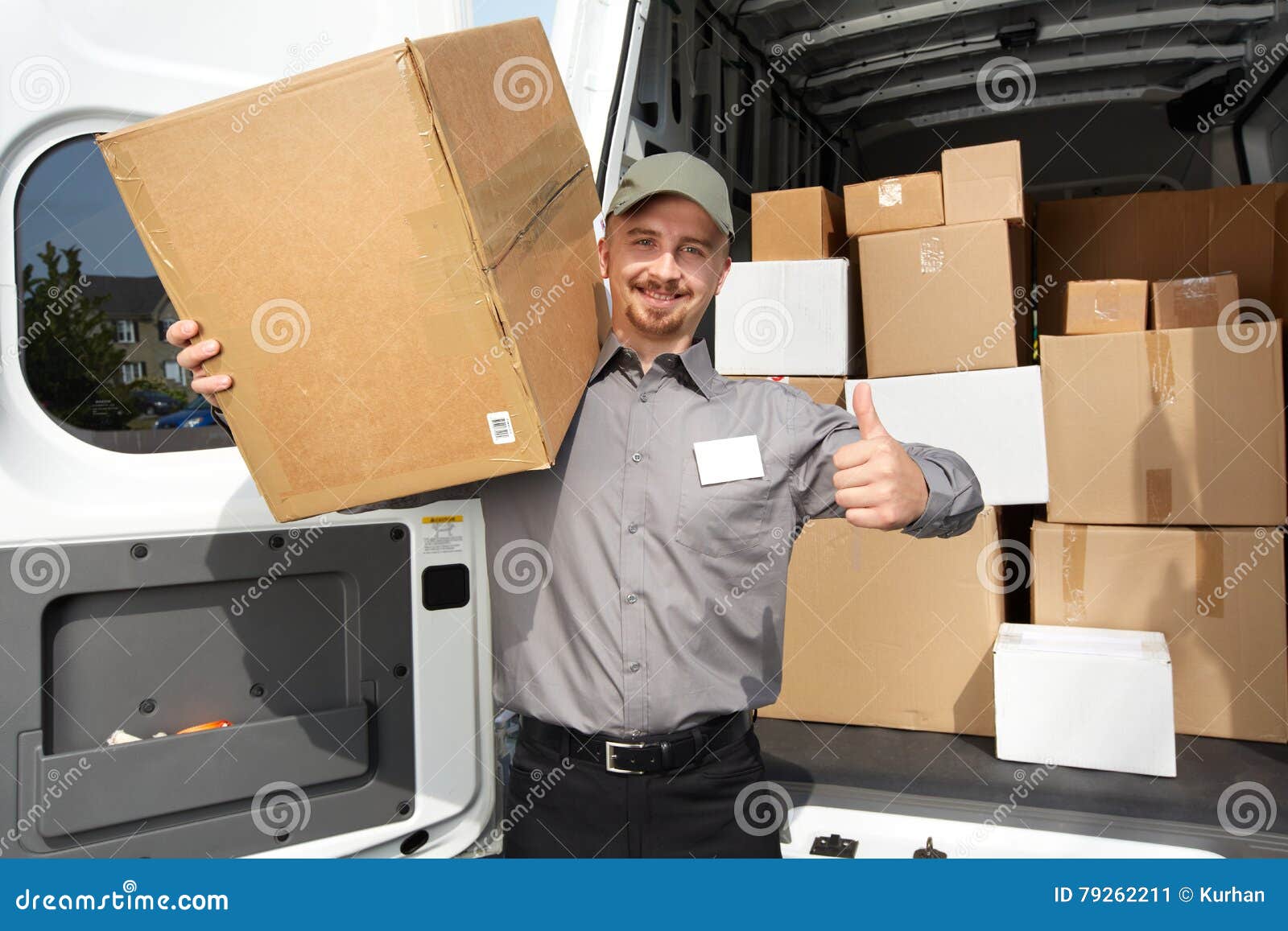Young Delivery Man with a Parcel. Stock Image - Image of business ...
