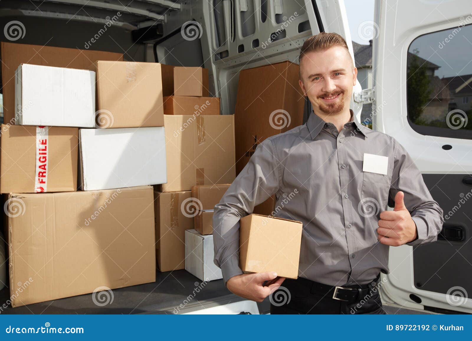 Young Delivery Man with a Parcel. Stock Photo - Image of people ...