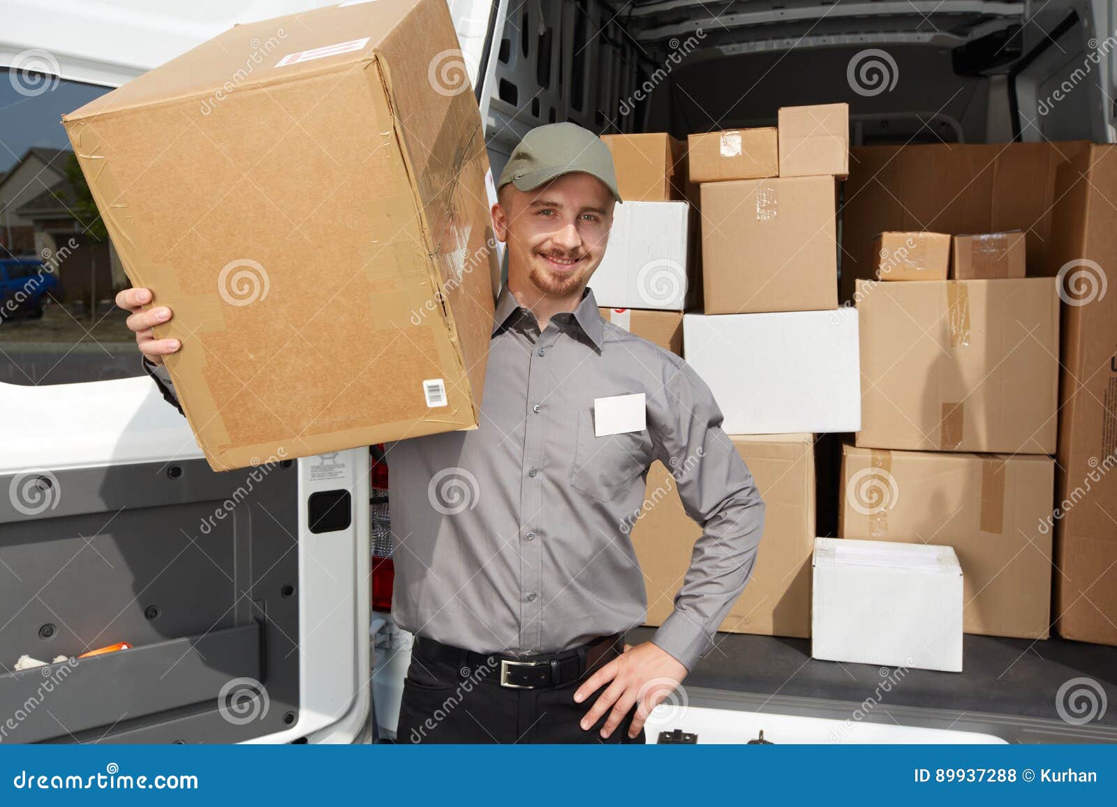 Young Delivery Man with a Parcel. Stock Photo - Image of postal ...