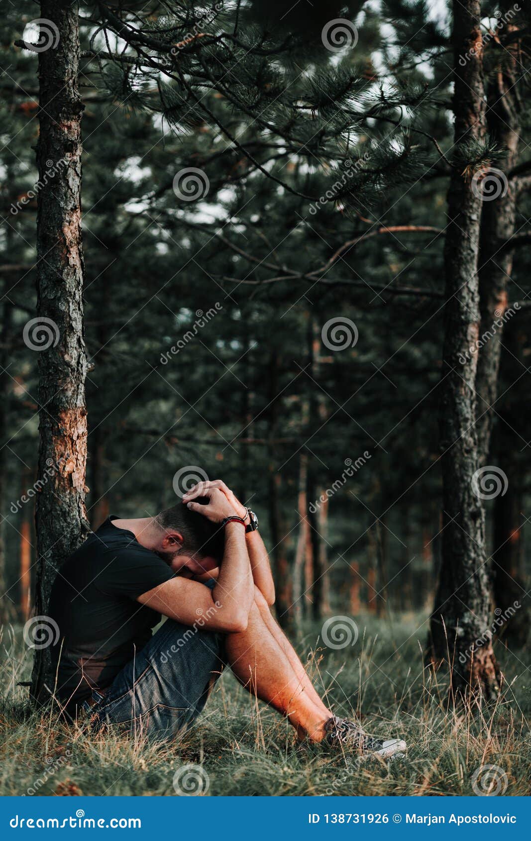 Young Depressed Man Sitting Alone in the Woods Stock Photo - Image of ...
