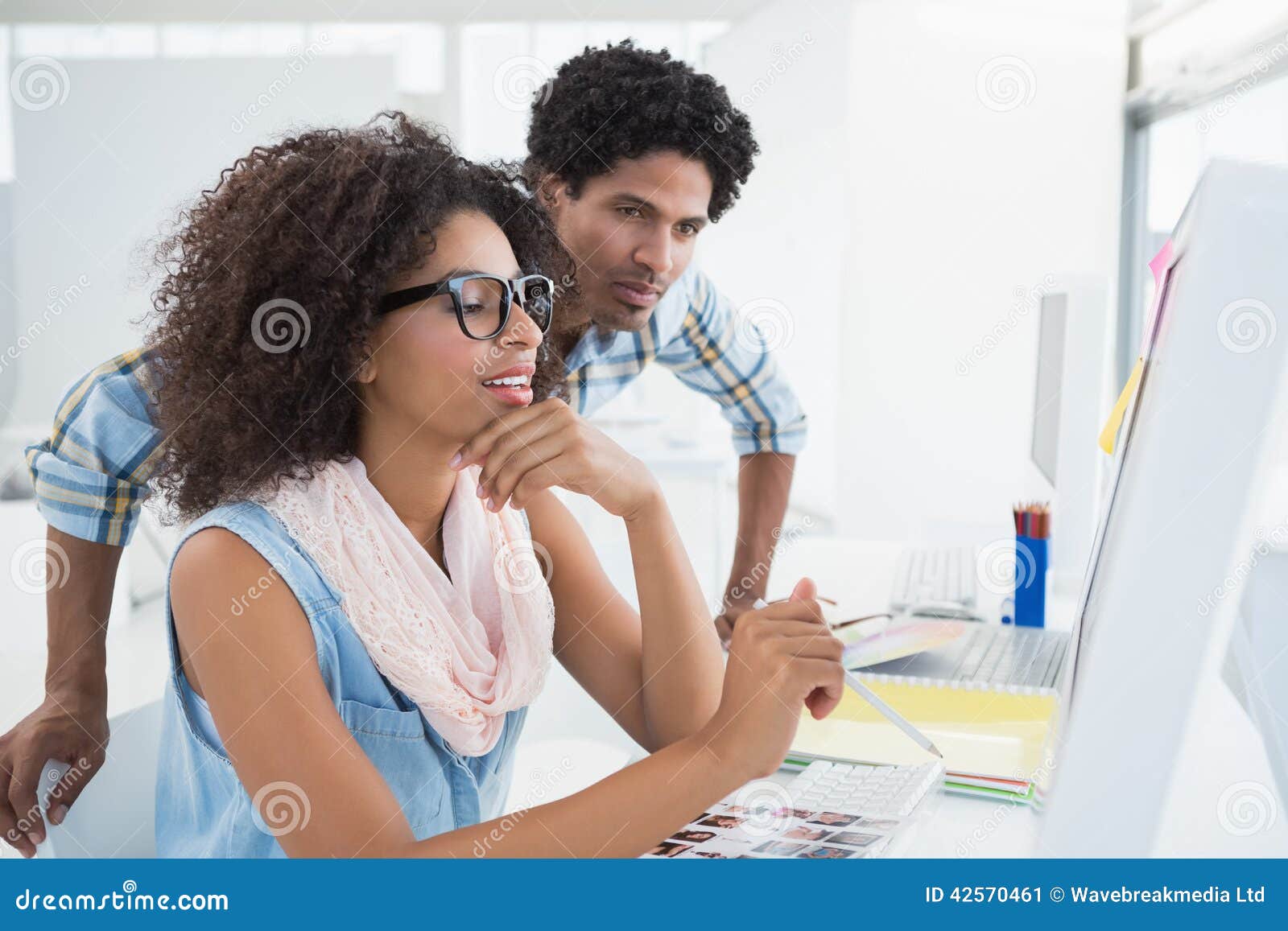 Young Design Team Working Together at Desk Stock Image - Image of ...