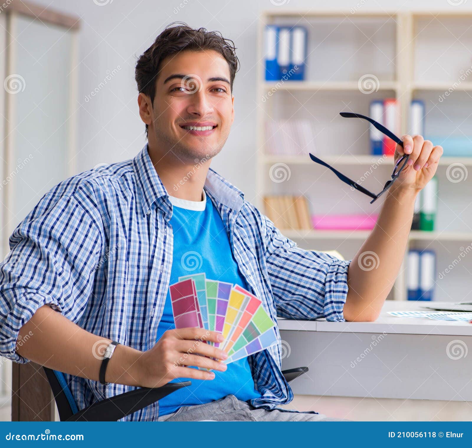 Young Designer Working on New Project and Choosing Colours Stock Photo ...