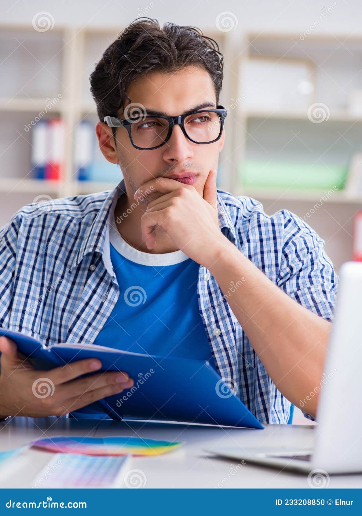 Young Designer Working on New Project and Choosing Colours Stock Photo ...