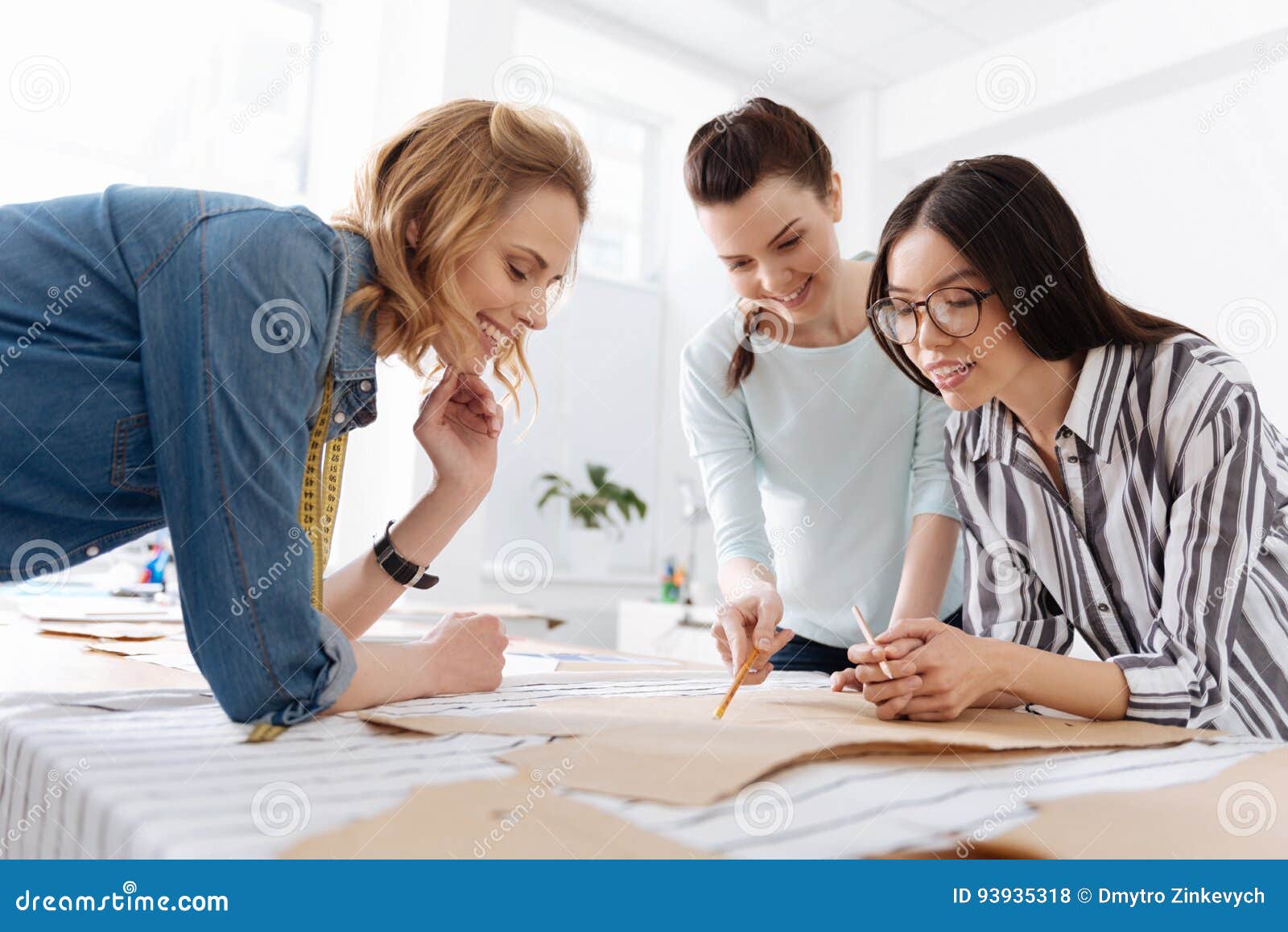 Young Designers Discussing Placement of Patterns Stock Photo - Image of ...