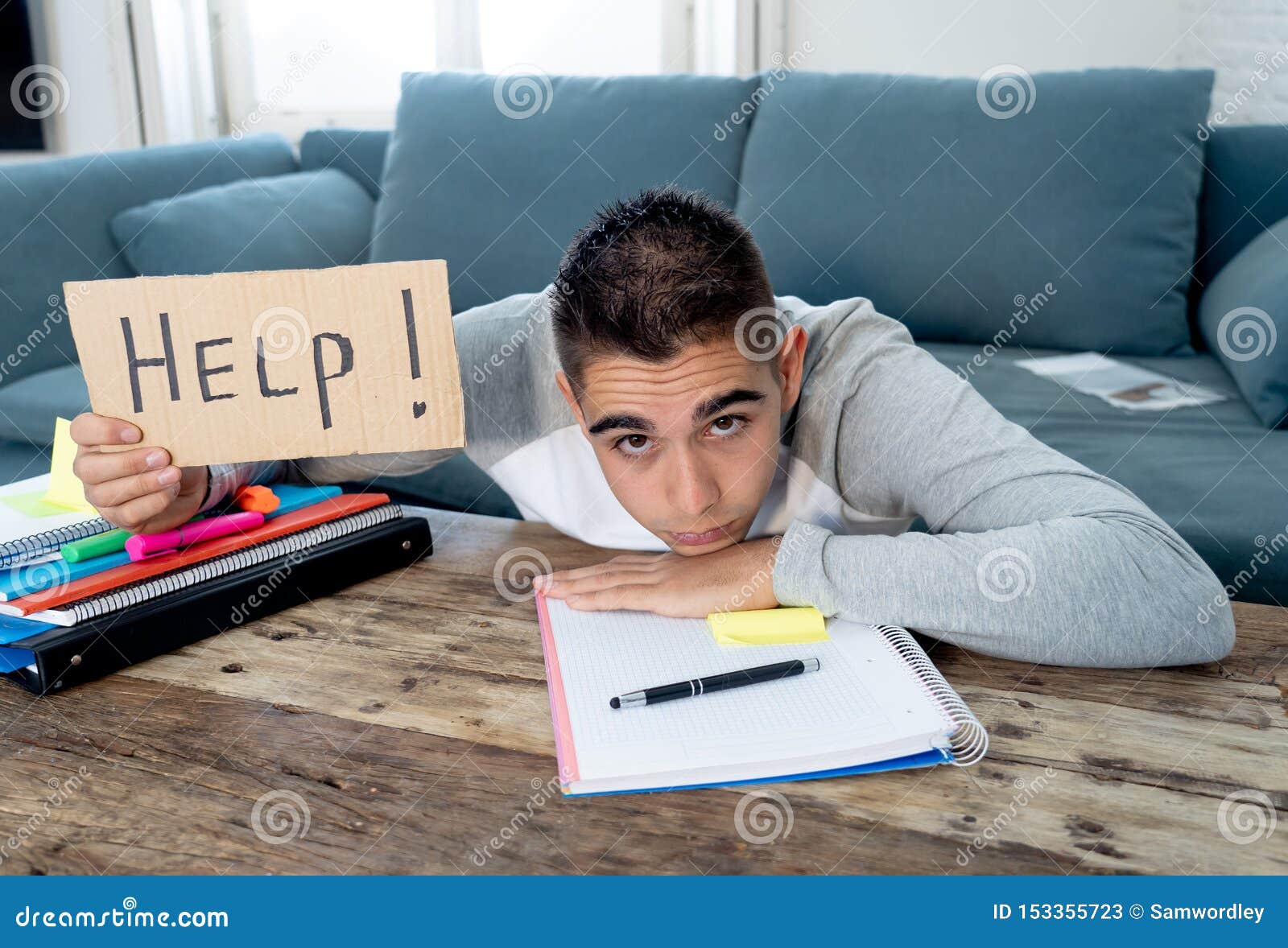 Young Desperate Student in Stress Working and Studying Holding a Help ...