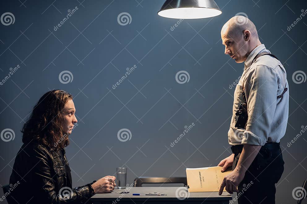 A Young Detective Interviews a Suspect in a Crime Stock Image - Image ...