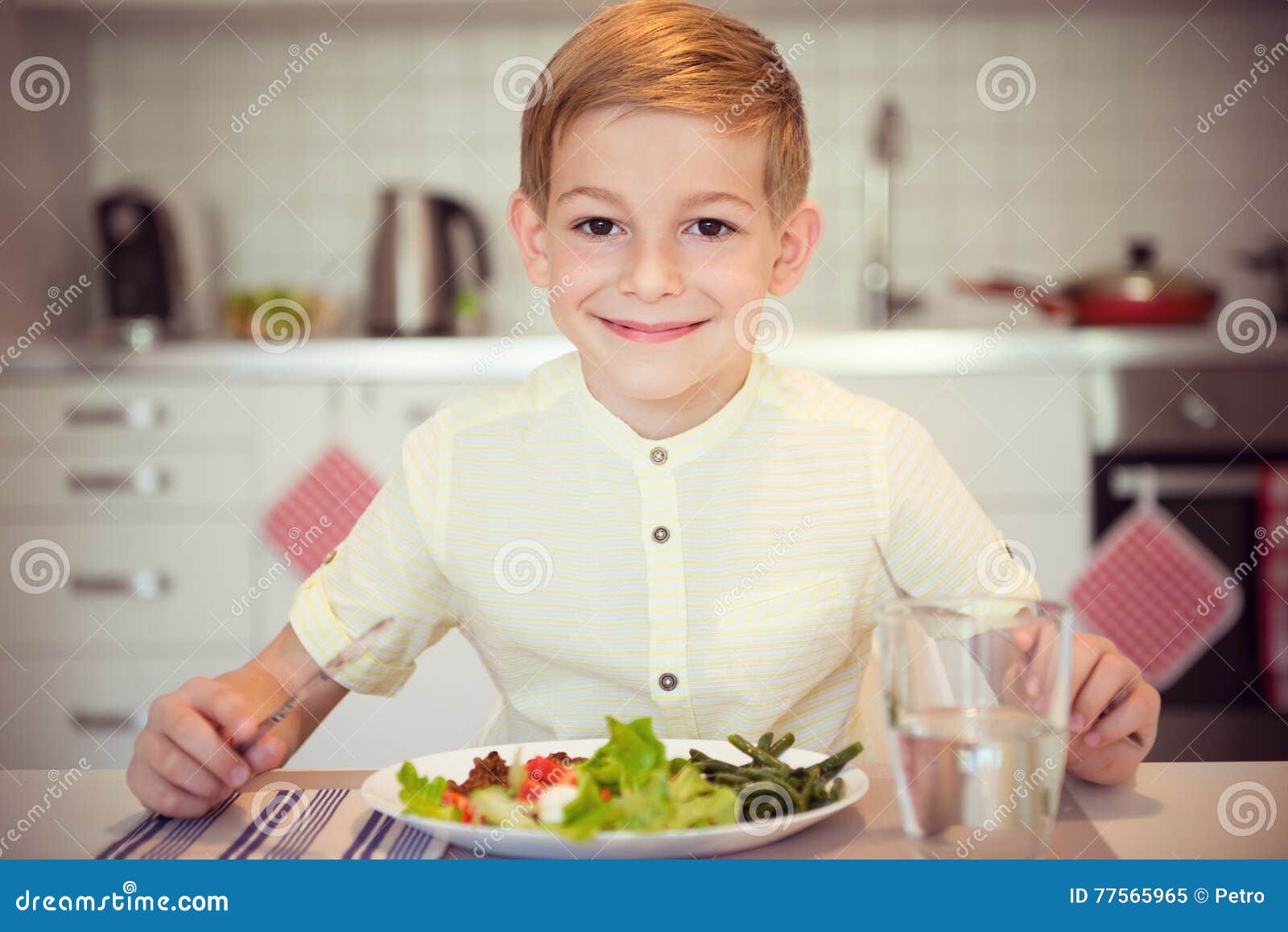 Young Diligent Boy at a Table Eating Healthy Meal with Cutlery Stock ...