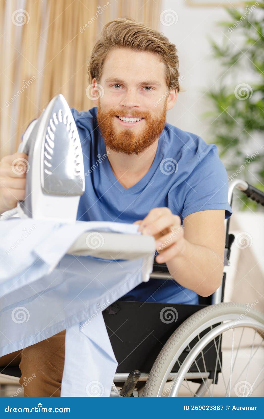 Young disable man ironing stock image. Image of injury - 269023887