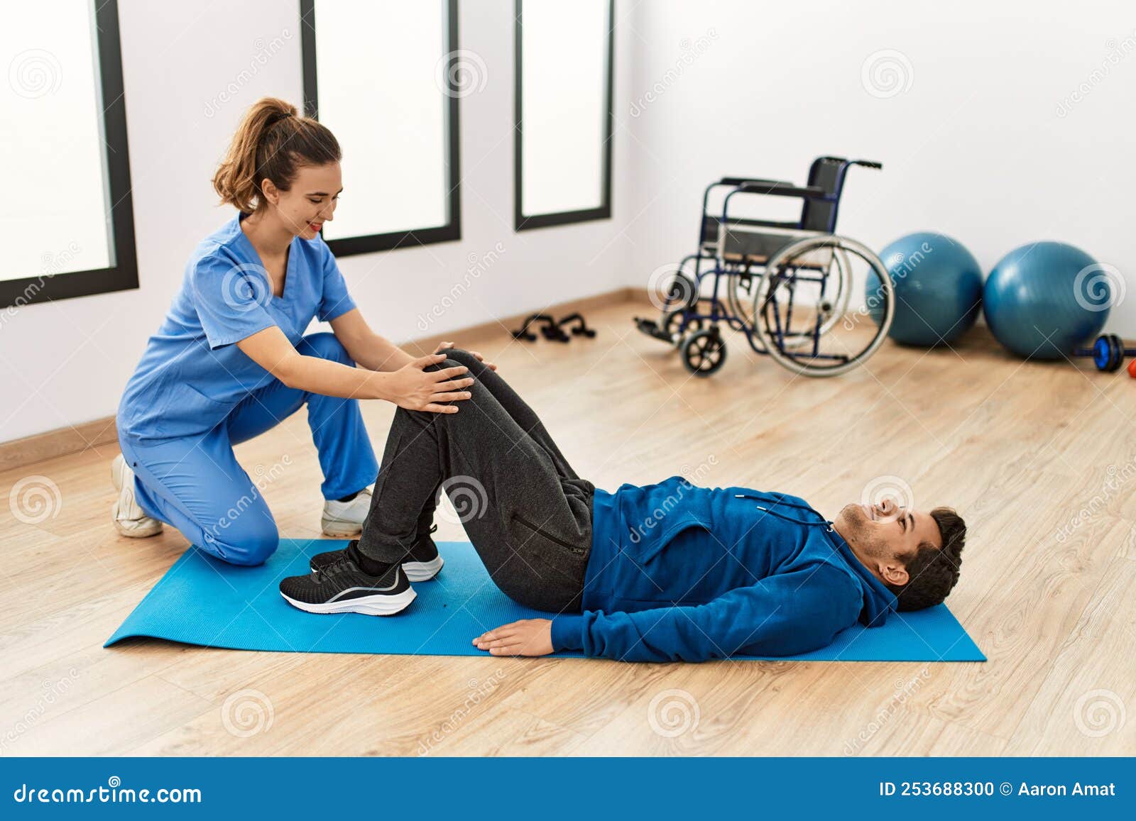 Young Disabled Man Making Mobility Exercise at the Clinic Stock Photo ...