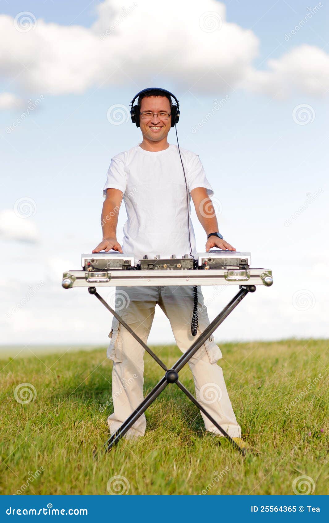Young disc jockey stock image. Image of glad, grass, party - 25564365