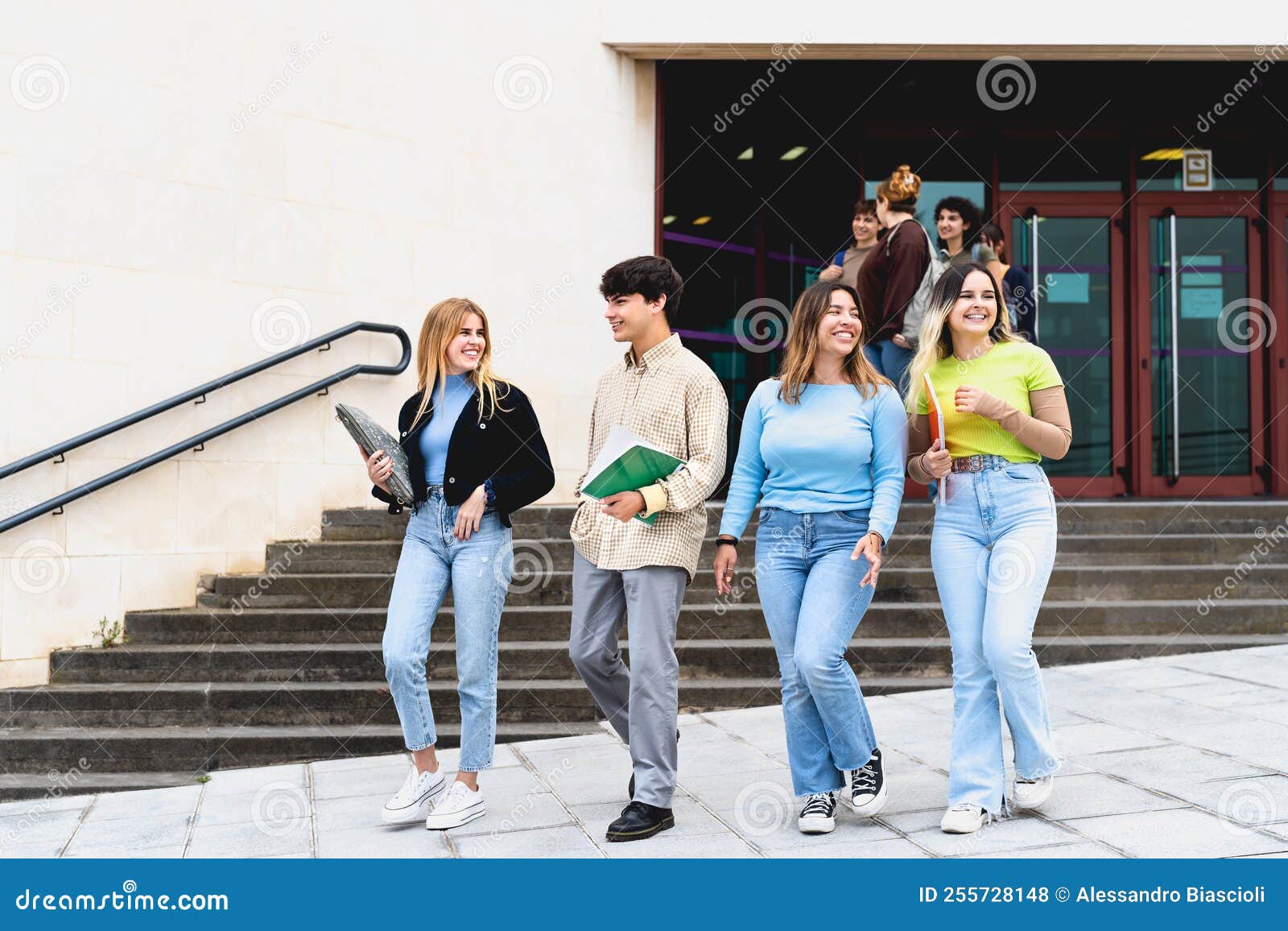 Young Diverse Students Leaving University after Lesson Stock Photo ...