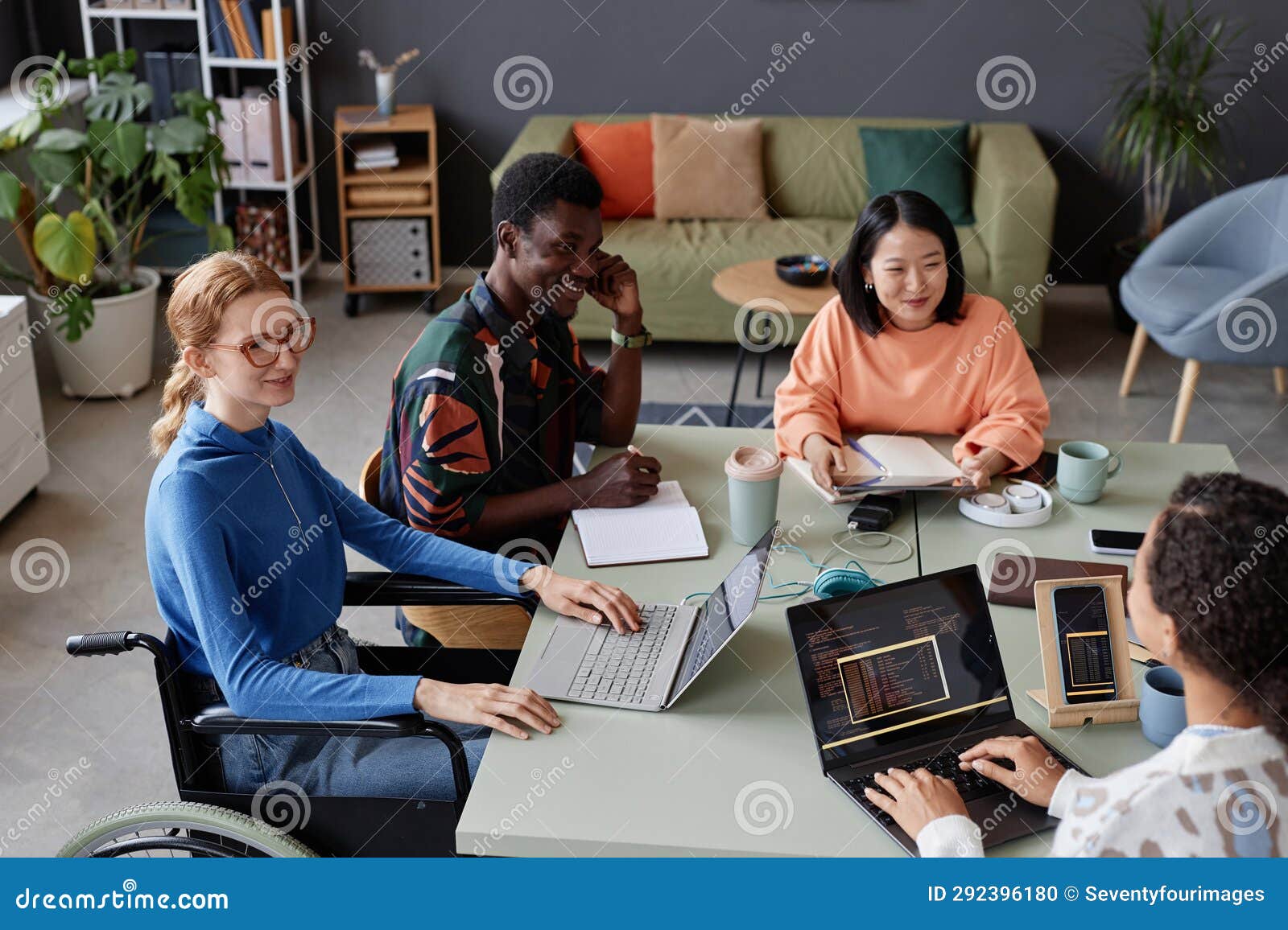 Young Diverse it Team Meeting at Table in Office and Discussing Project ...