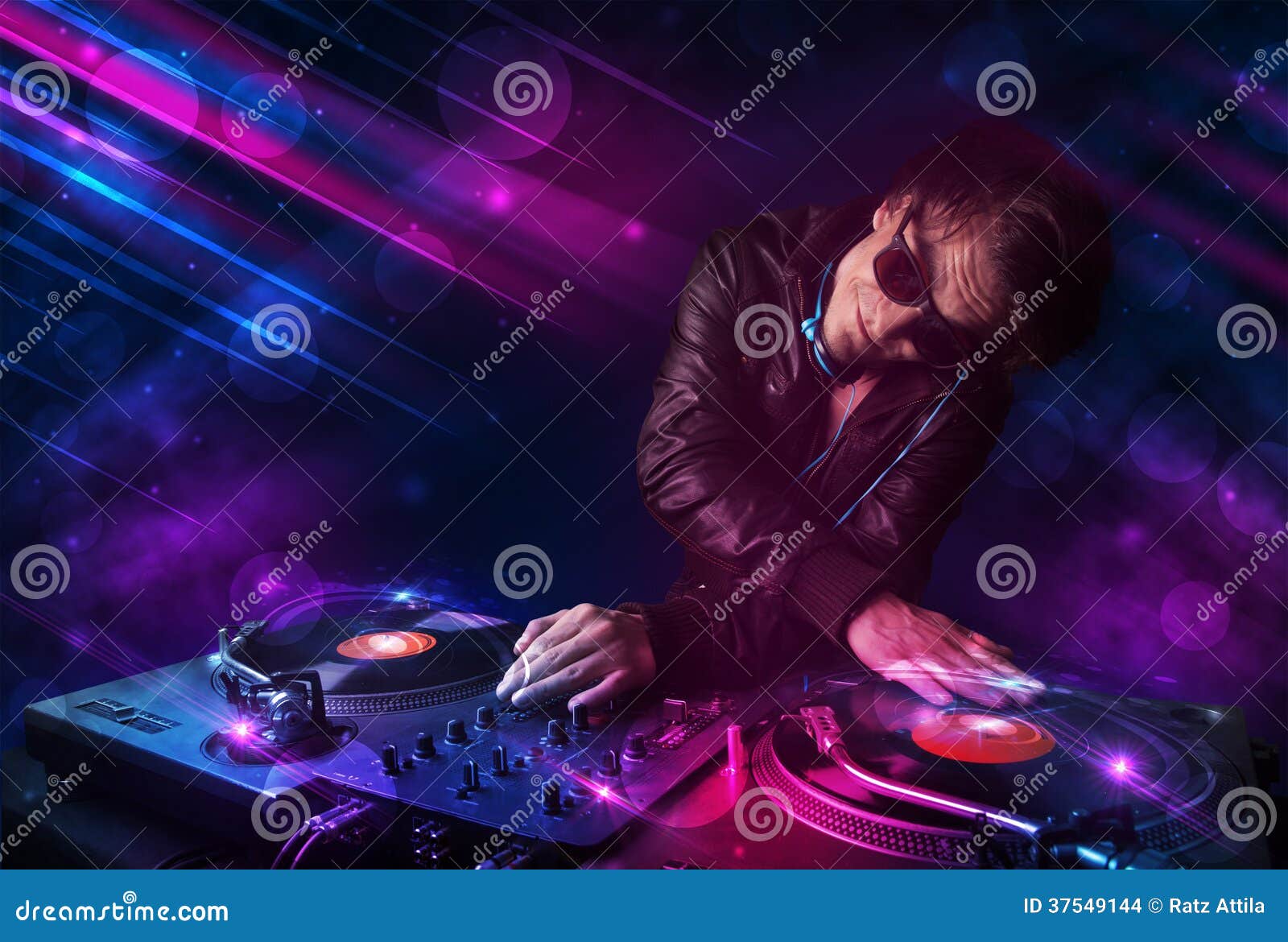 Young DJ Playing on Turntables with Color Light Effects Stock ...