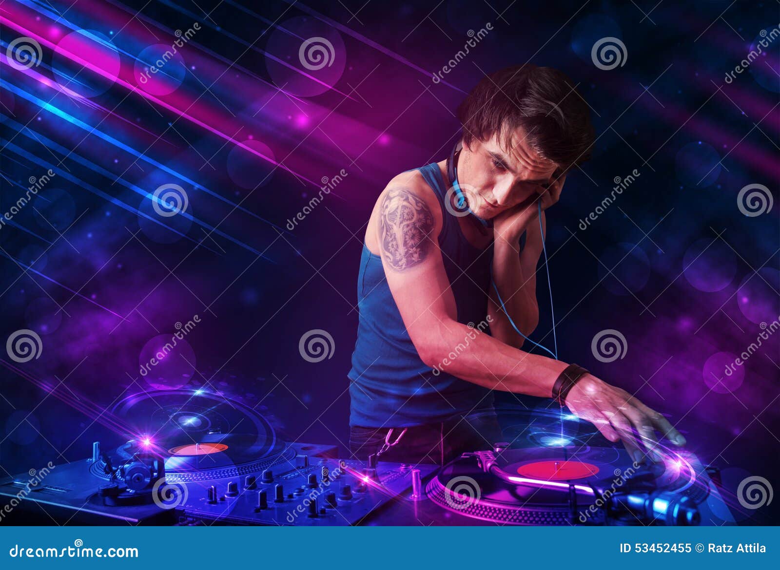 Young DJ Playing on Turntables with Color Light Effects Stock Image ...