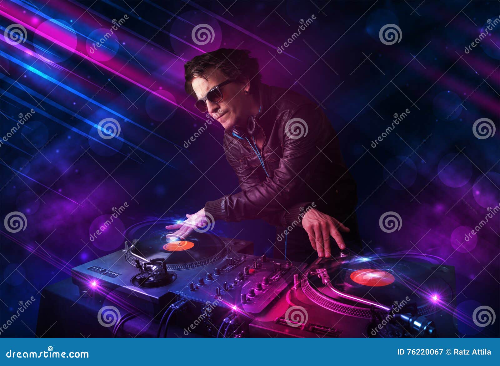 Young DJ Playing on Turntables with Color Light Effects Stock Image ...