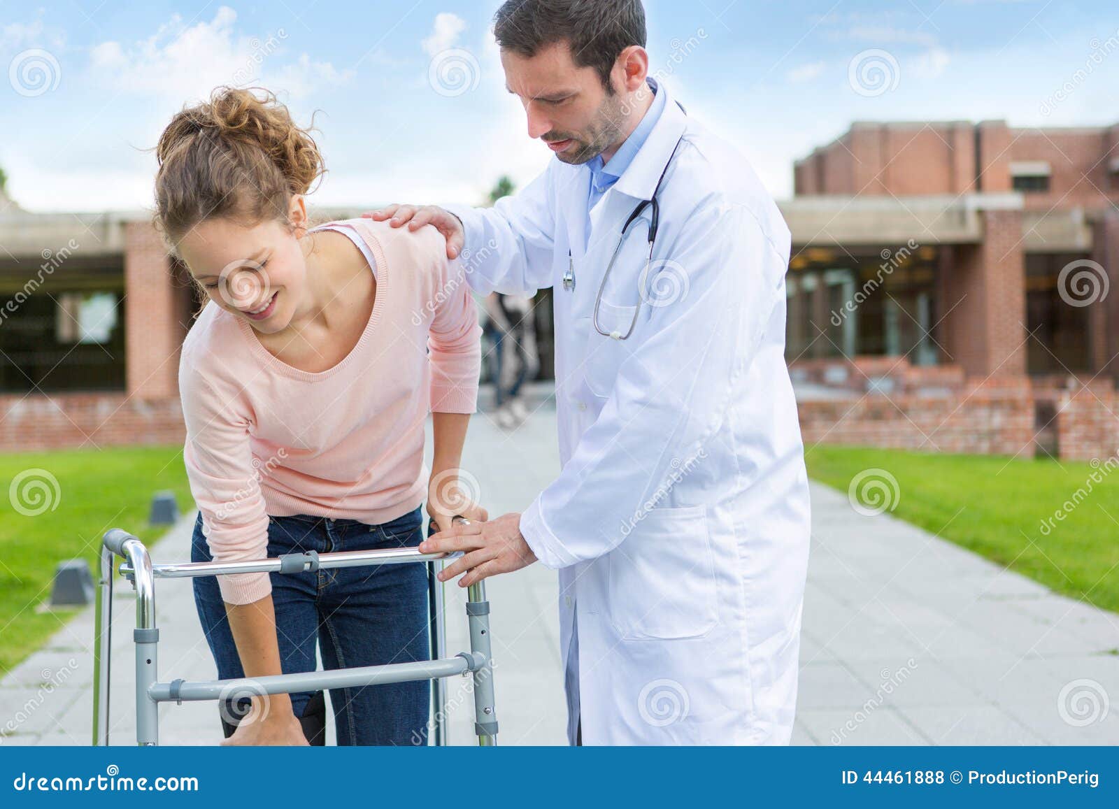 Young Doctor Assisting a Young Woman Stock Photo - Image of walk ...