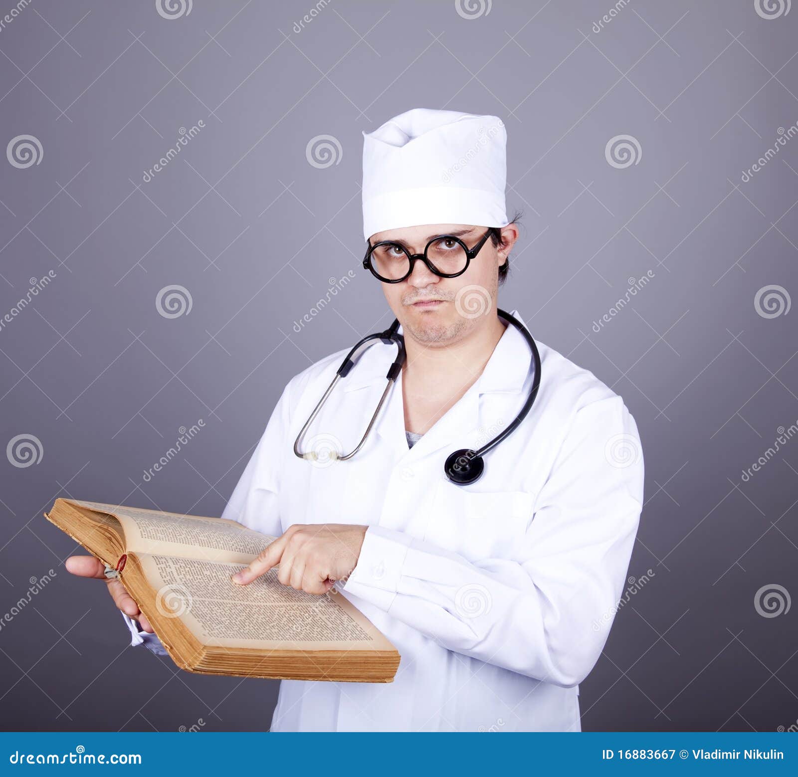 Young doctor with book. stock image. Image of practitioner - 16883667
