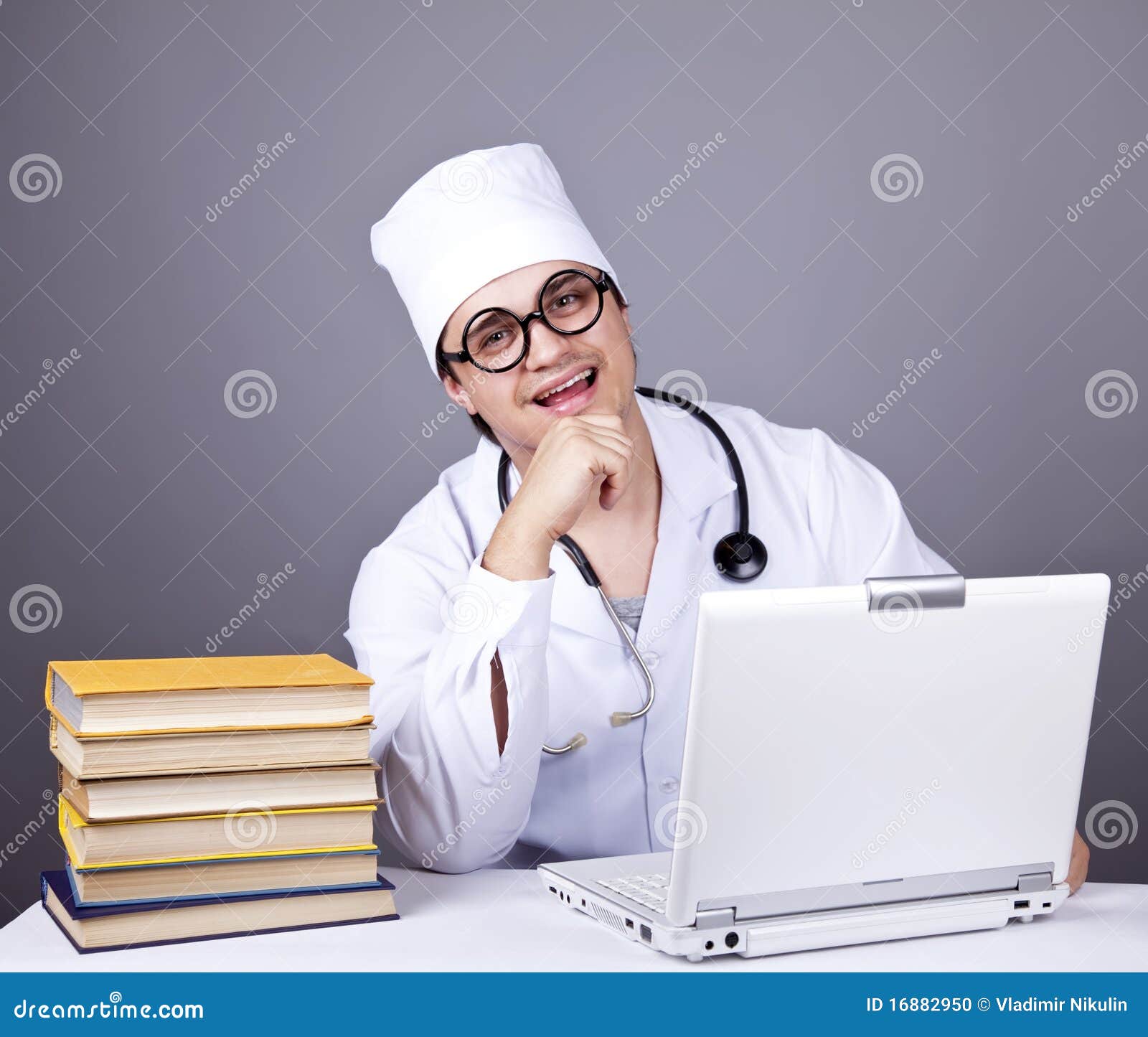 Young Doctor with Books and Computer. Stock Photo - Image of knowledge ...