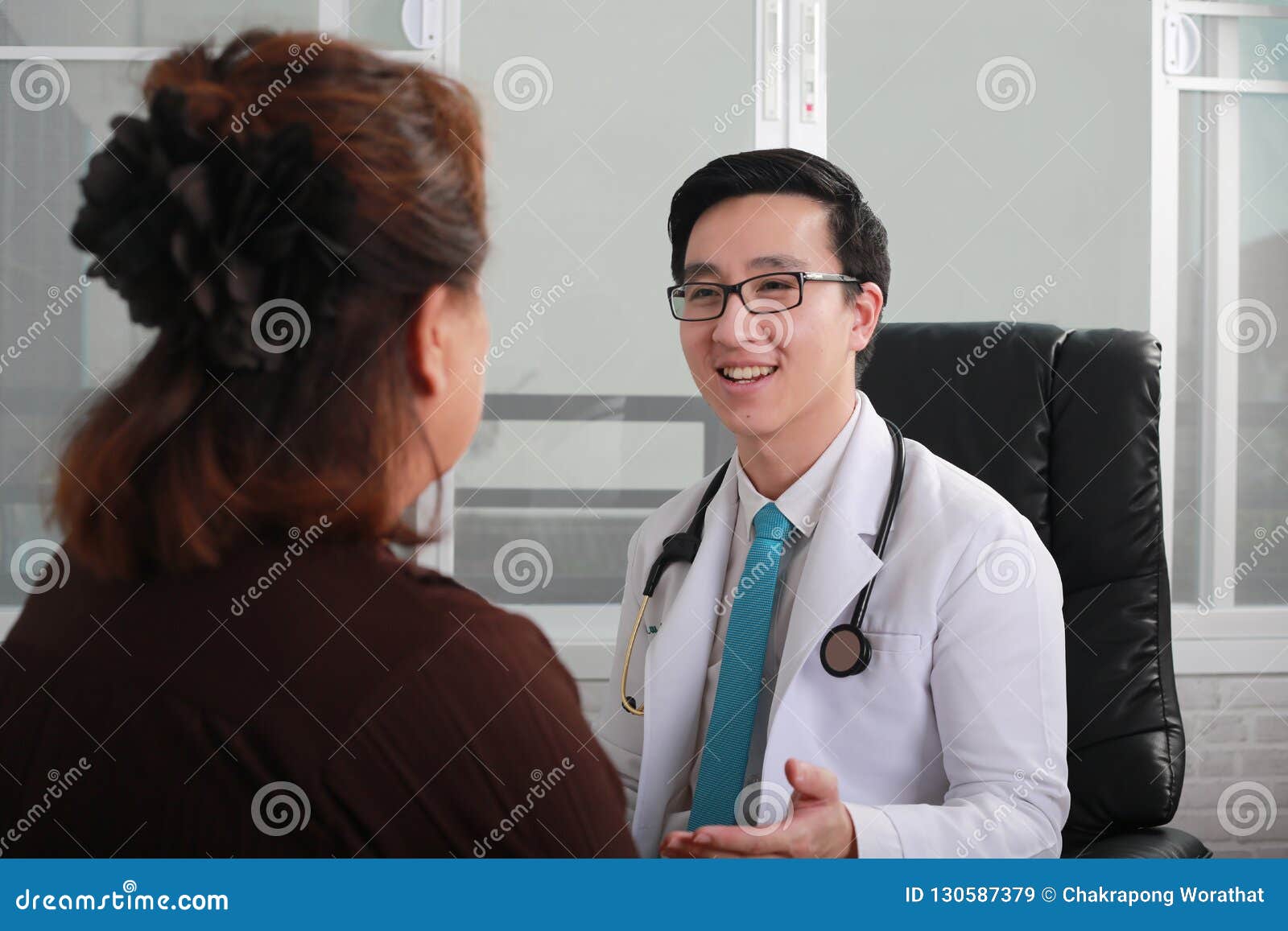 Young Doctor Consulting Patient at the Doctor Office. Stock Image ...