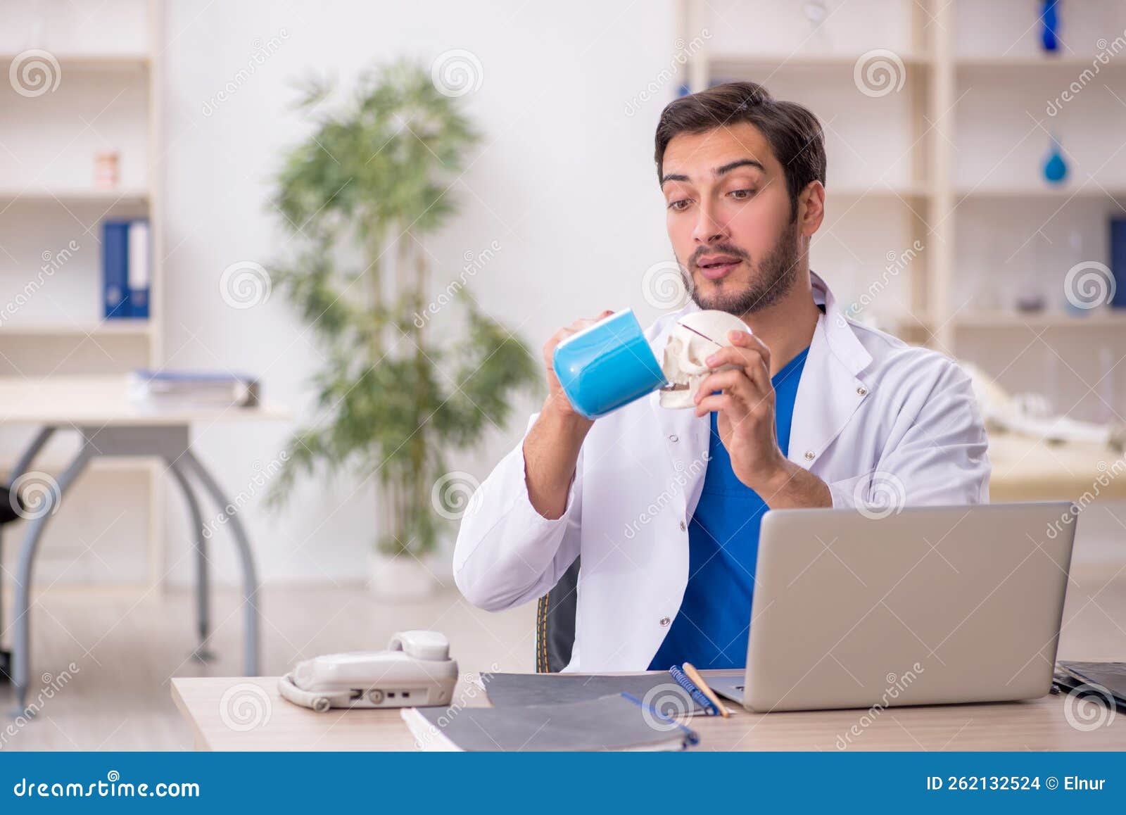 Young Male Doctor Drinking Coffee during Break Stock Photo - Image of ...