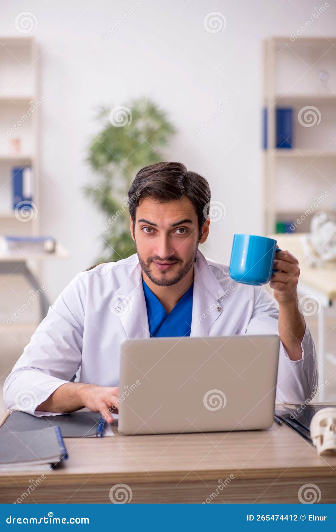 Young Male Doctor Drinking Coffee during Break Stock Photo - Image of ...