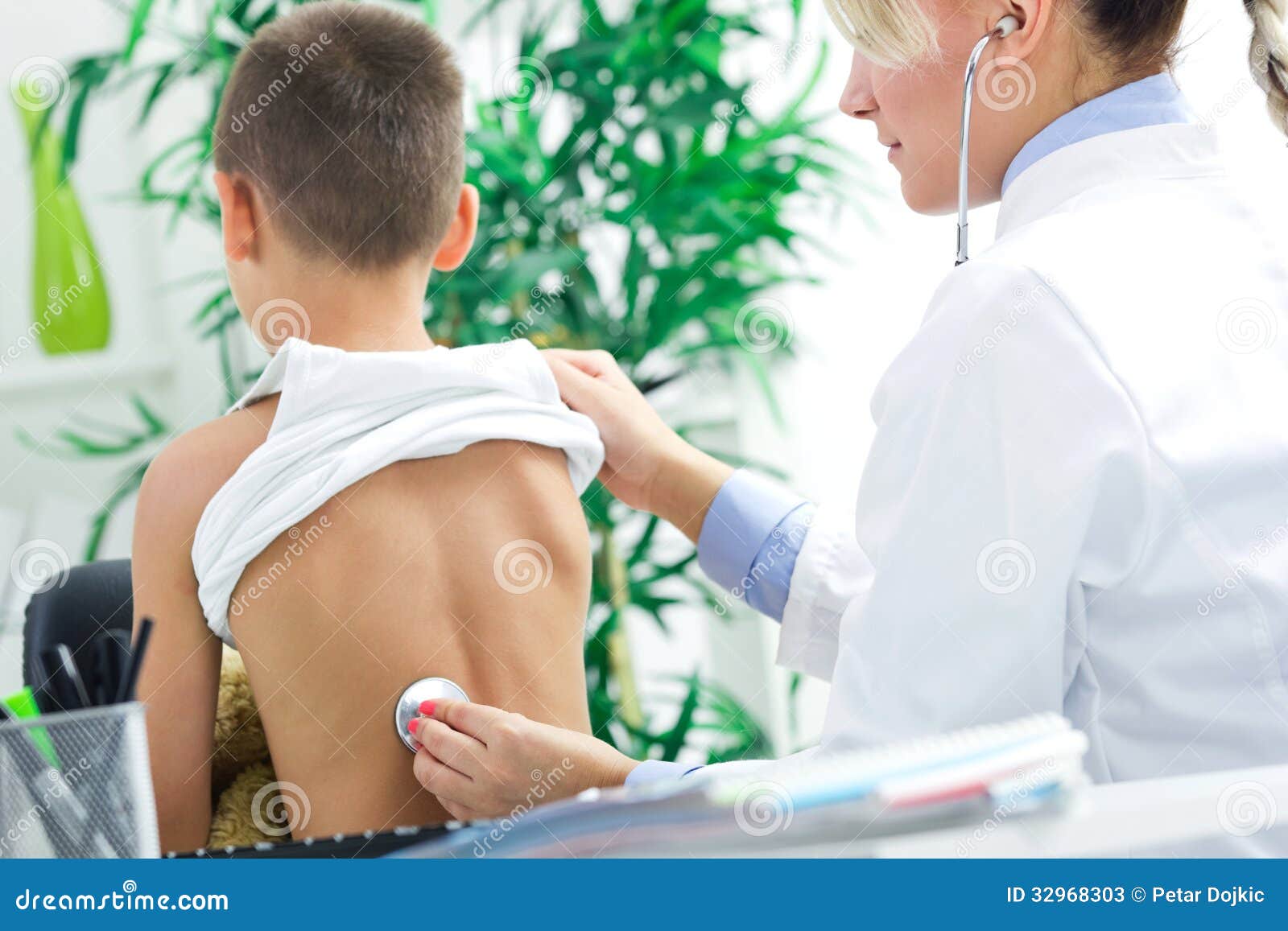 Young Doctor Examines the Boy S Back with Stethoscope Stock Image ...