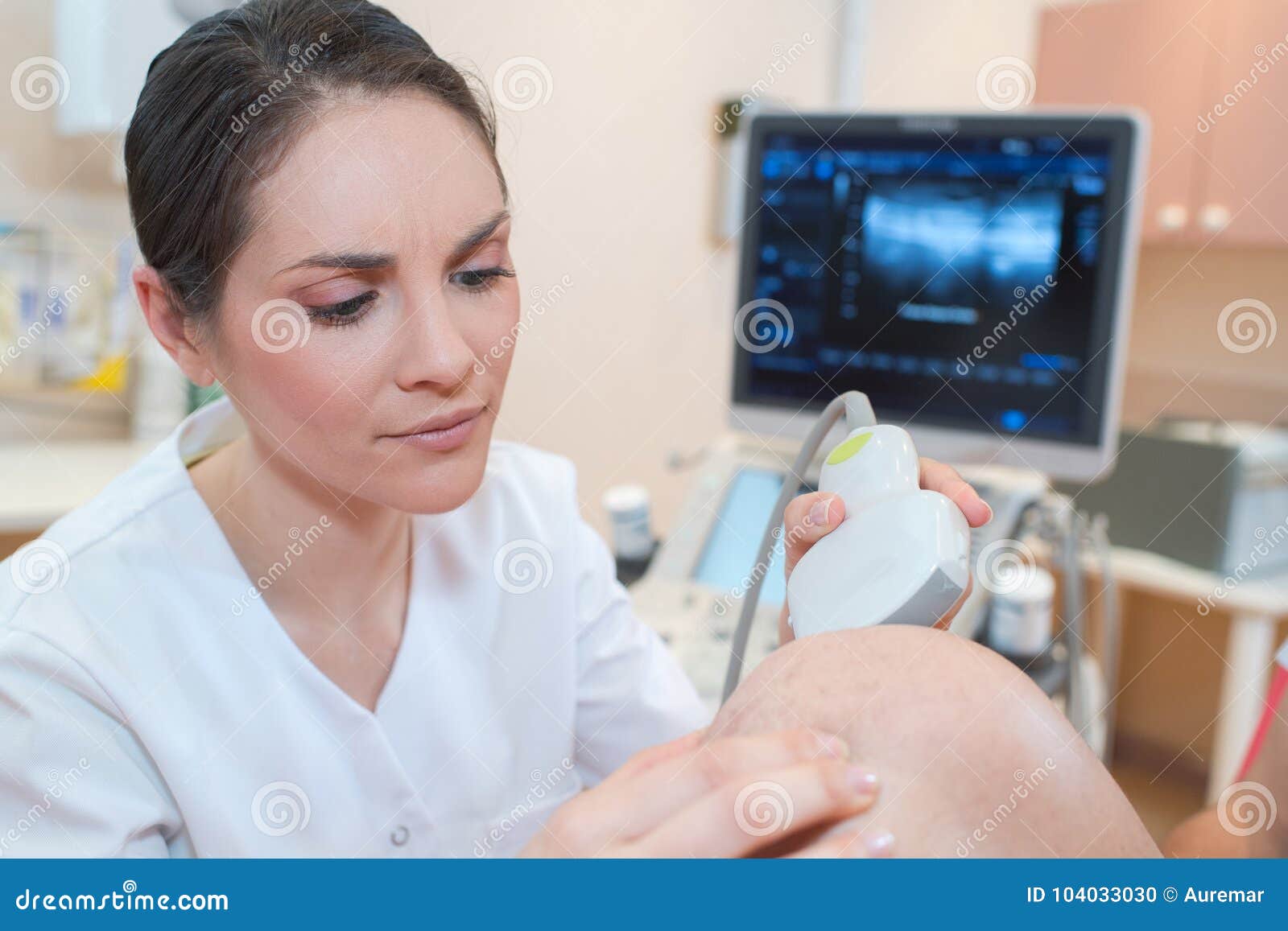 Young Doctor Examining Elderly Patients Hernia on Echograph Stock Photo ...