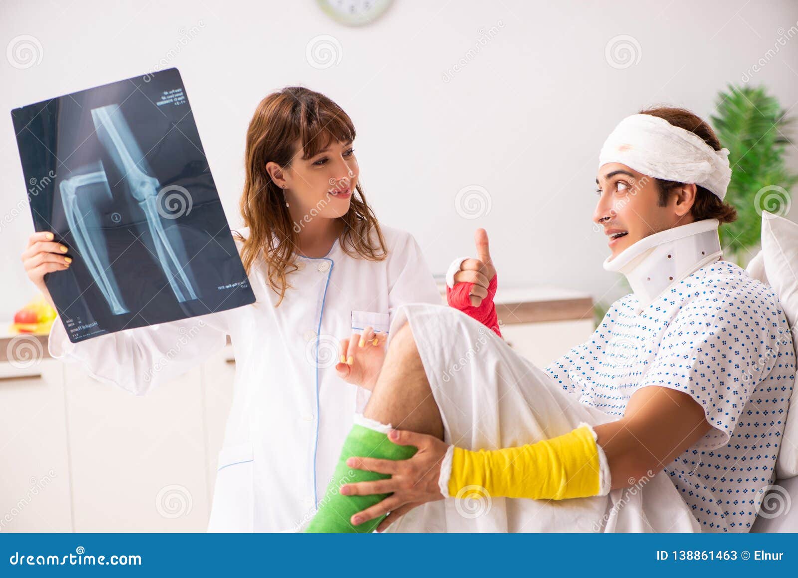 The Young Doctor Examining Injured Patient Stock Image - Image of ...