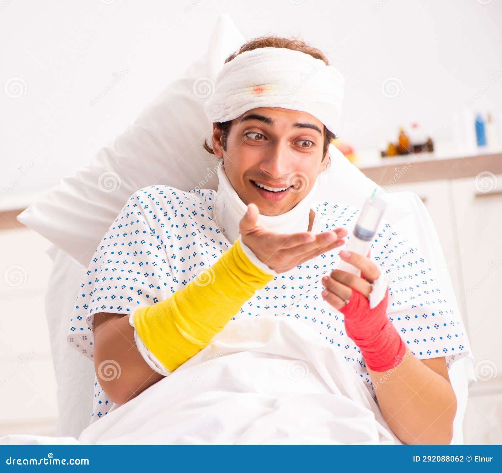 Young Doctor Examining Injured Patient Stock Photo - Image of needle ...