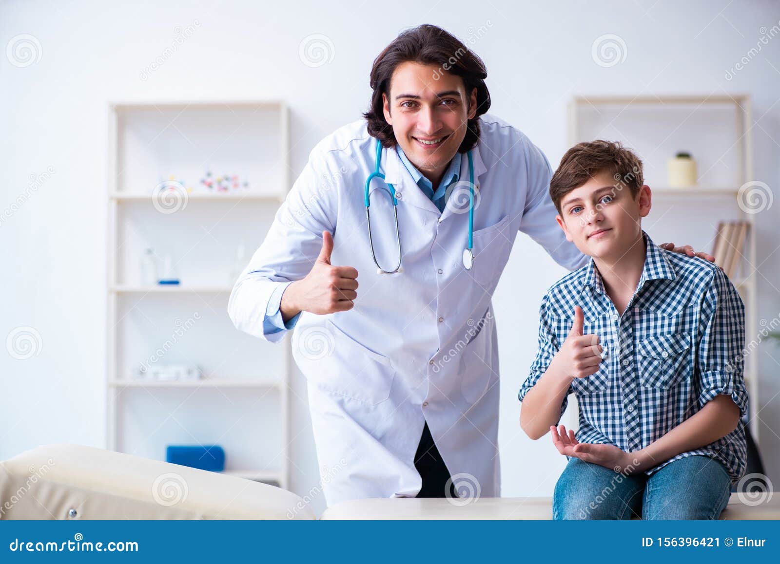 Young Doctor Examining Schoolboy for Regular Check-up Stock Image ...