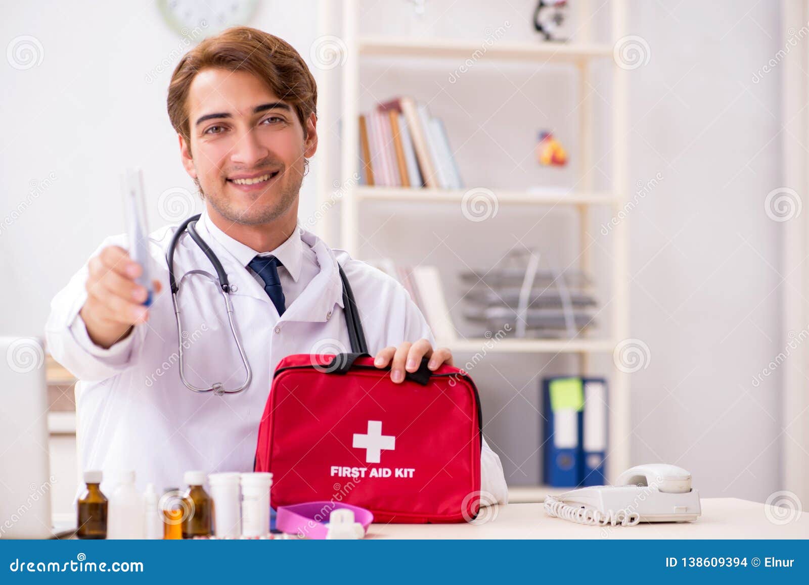 The Young Doctor with First Aid Kit in Hospital Stock Photo - Image of ...