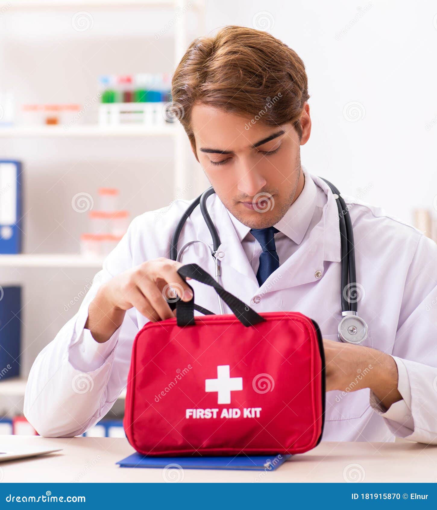 Young Doctor with First Aid Kit in Hospital Stock Photo - Image of ...