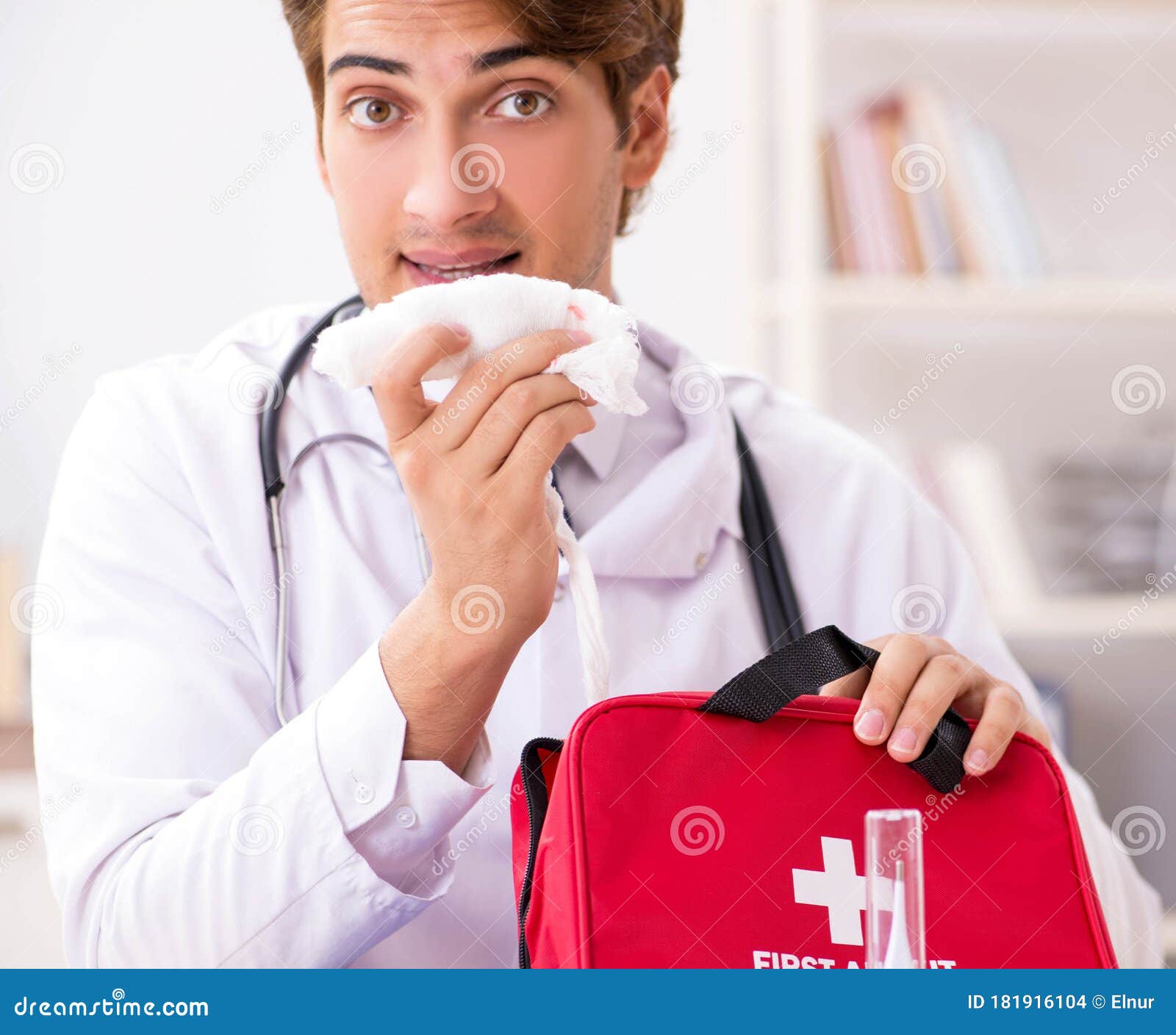 Young Doctor with First Aid Kit in Hospital Stock Photo - Image of ...