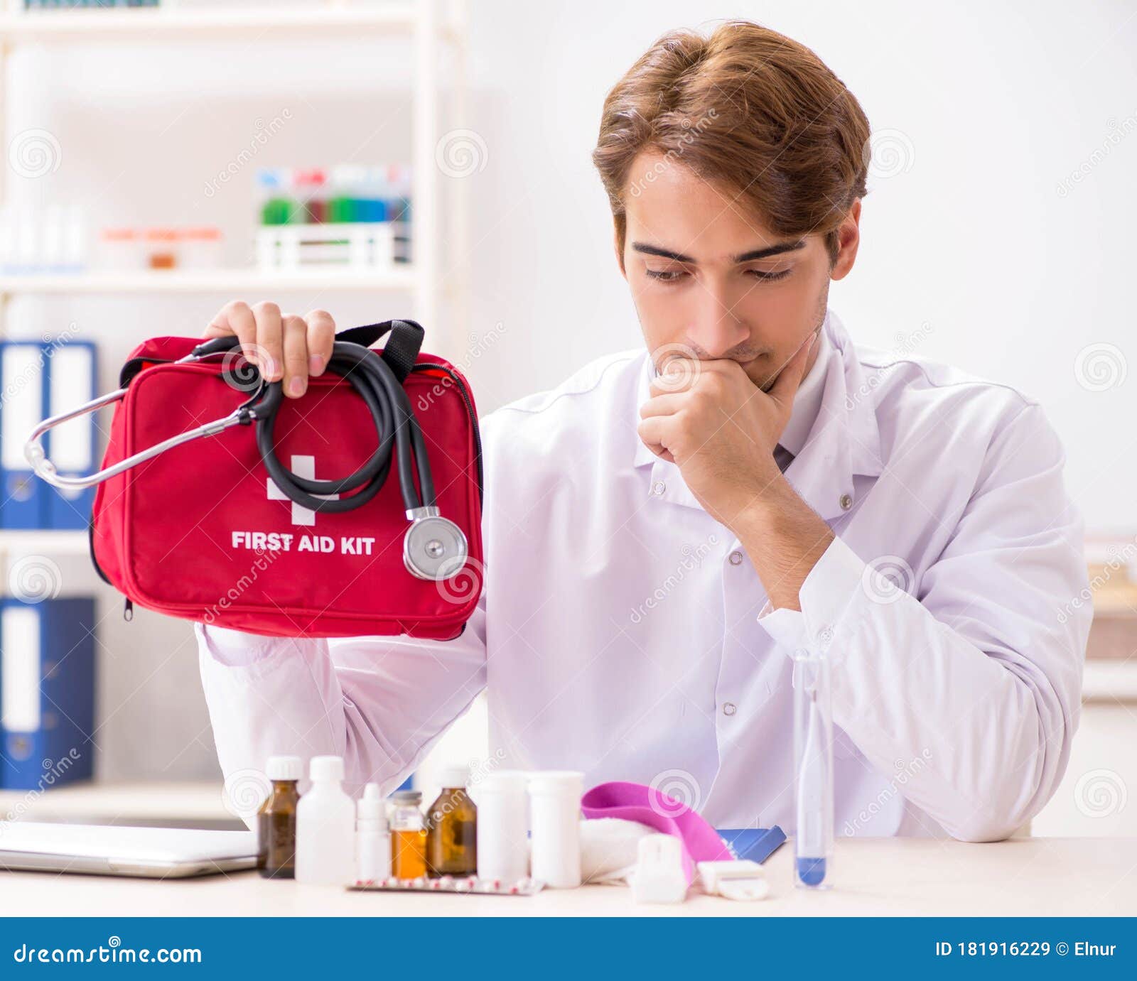 Young Doctor with First Aid Kit in Hospital Stock Image - Image of ...
