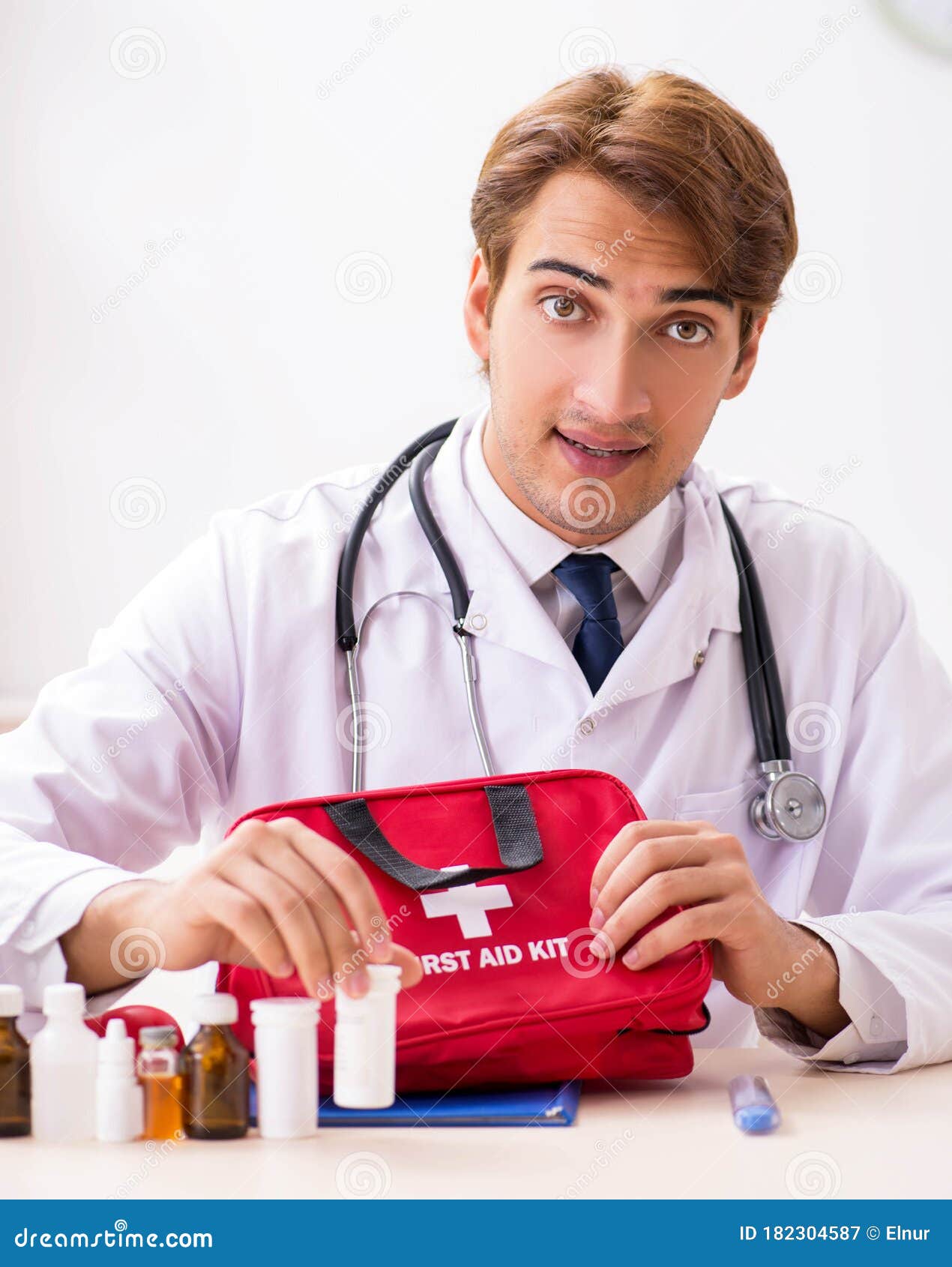 Young Doctor with First Aid Kit in Hospital Stock Image - Image of ...
