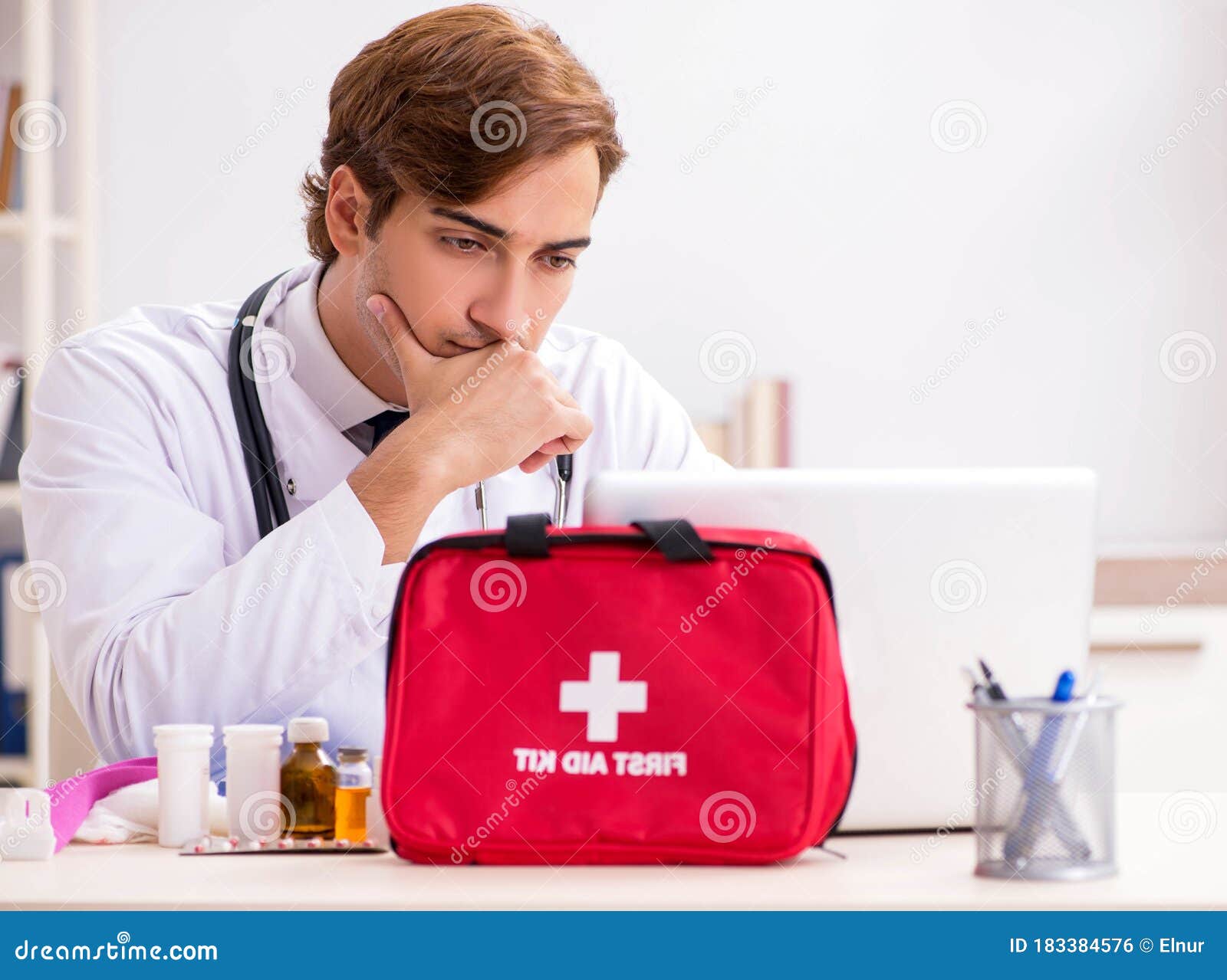 Young Doctor with First Aid Kit in Hospital Stock Photo - Image of ...