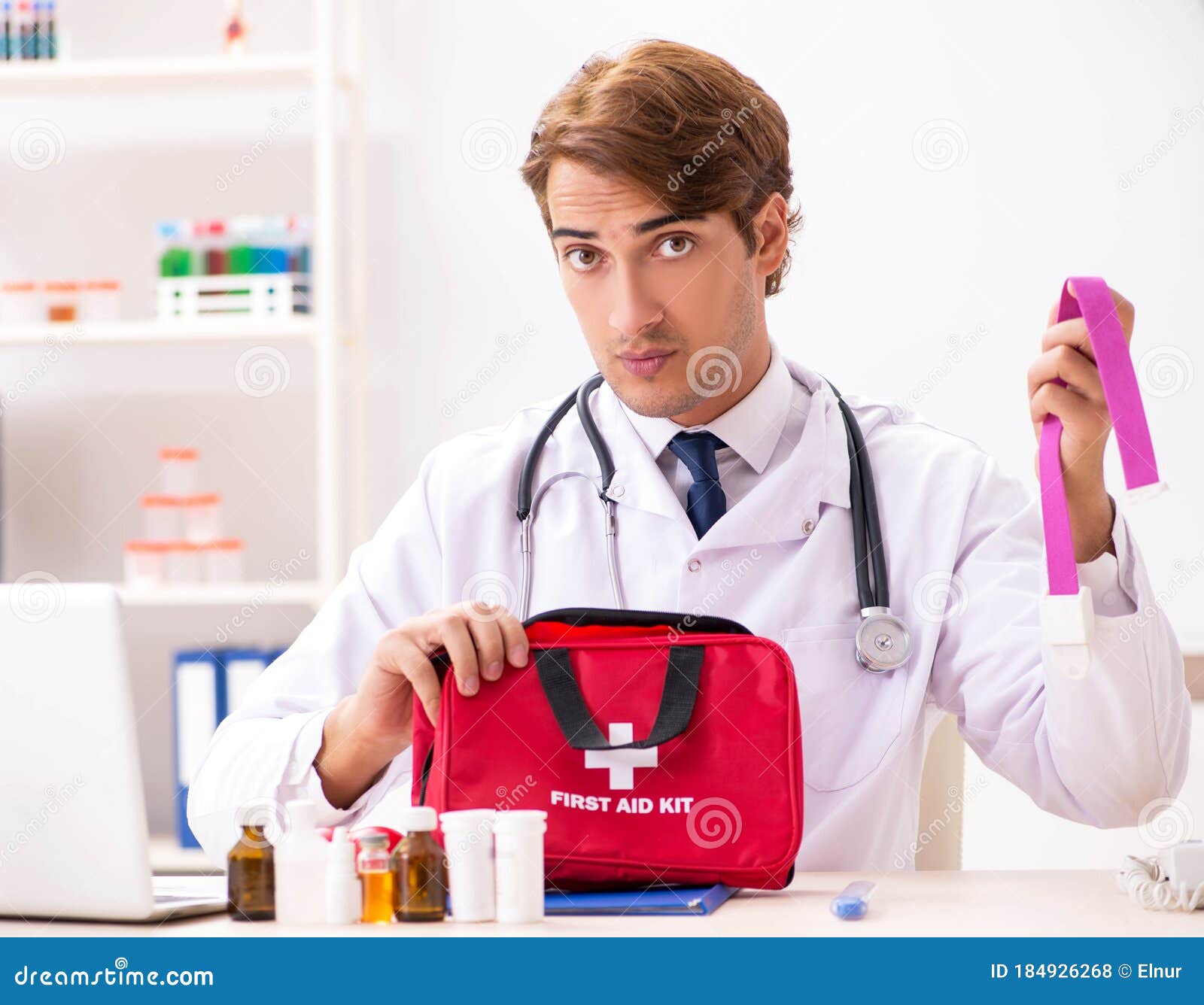 Young Doctor with First Aid Kit in Hospital Stock Photo - Image of ...