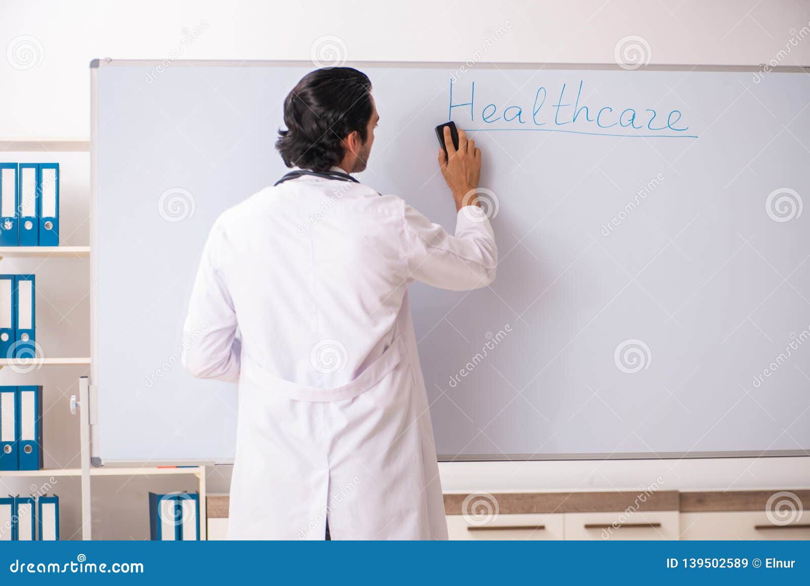 The Young Doctor in Front of Whiteboard Stock Image - Image of ...