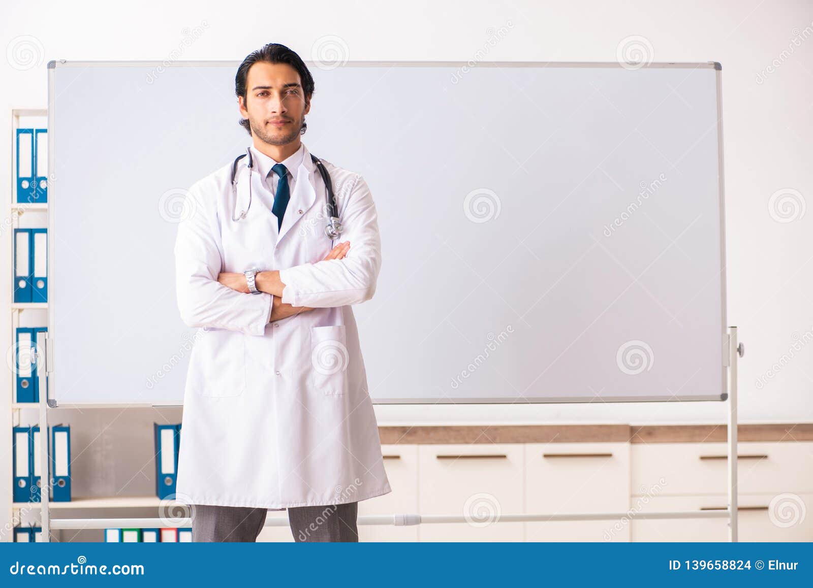 The Young Doctor in Front of Whiteboard Stock Photo - Image of doctor ...