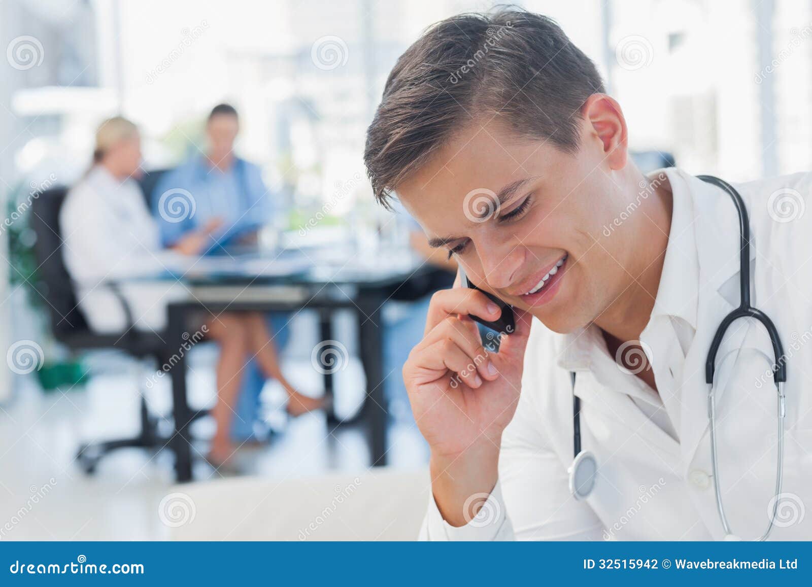 Young Doctor Having a Phone Call Stock Photo - Image of service, office ...