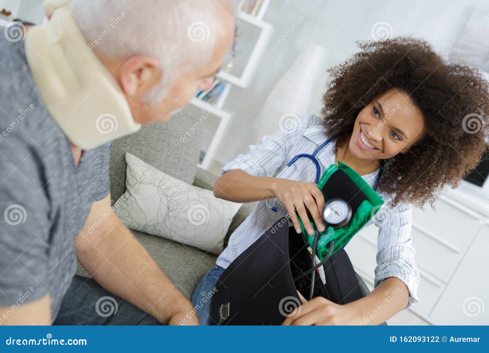 Young Doctor Helping Senior Man Stock Photo - Image of confidence ...