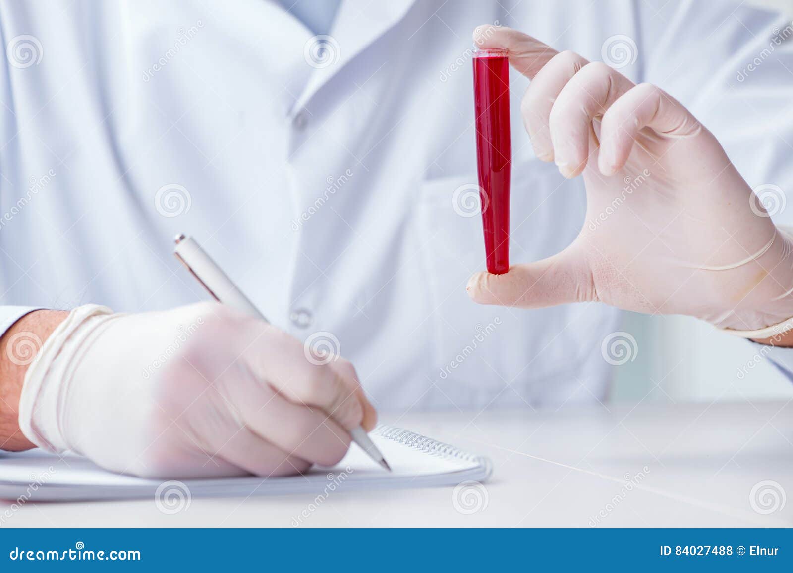 The Young Doctor in the Lab with Red Tube Stock Photo - Image of ...
