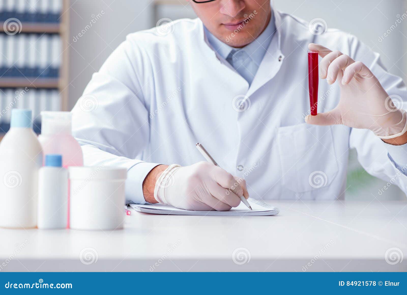 The Young Doctor in the Lab with Red Tube Stock Photo - Image of ...