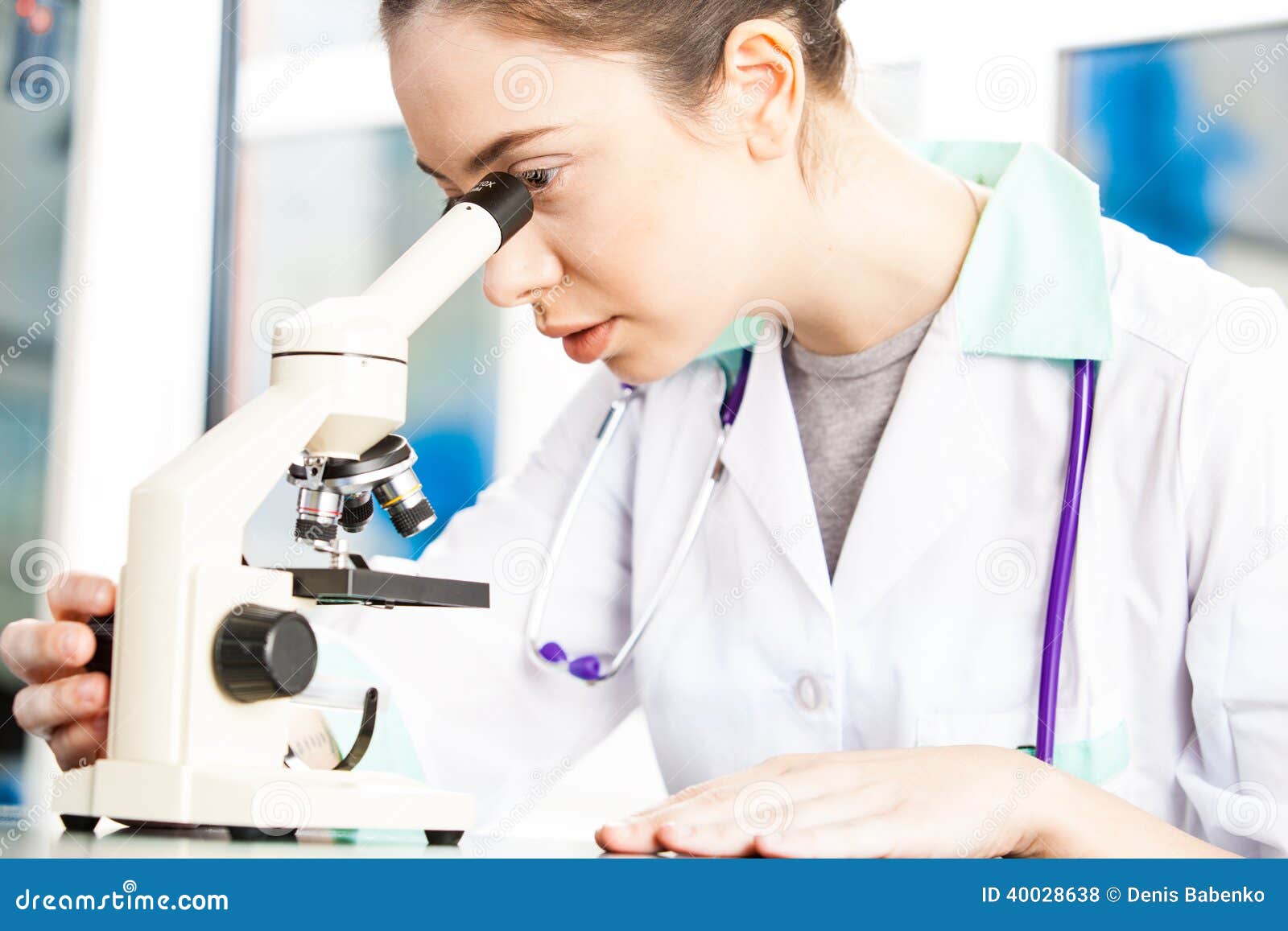 Young Doctor Looking into a Microscope Stock Photo - Image of ...