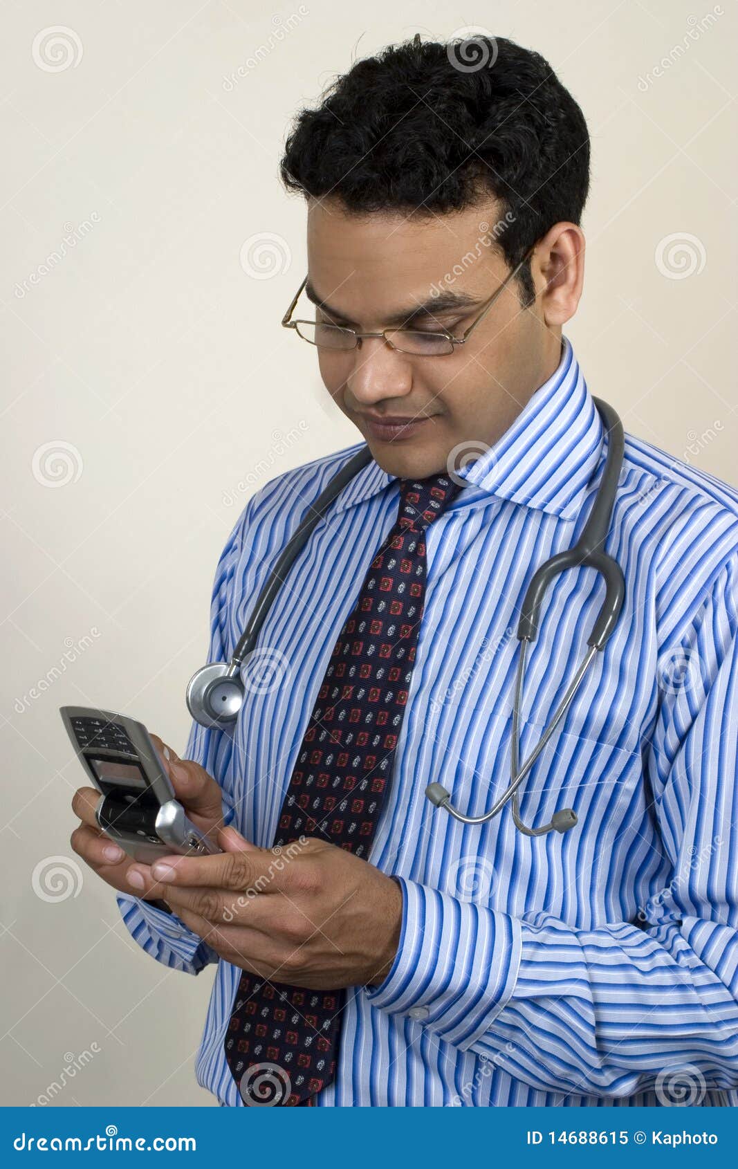 Young doctor with mobile stock image. Image of asian - 14688615