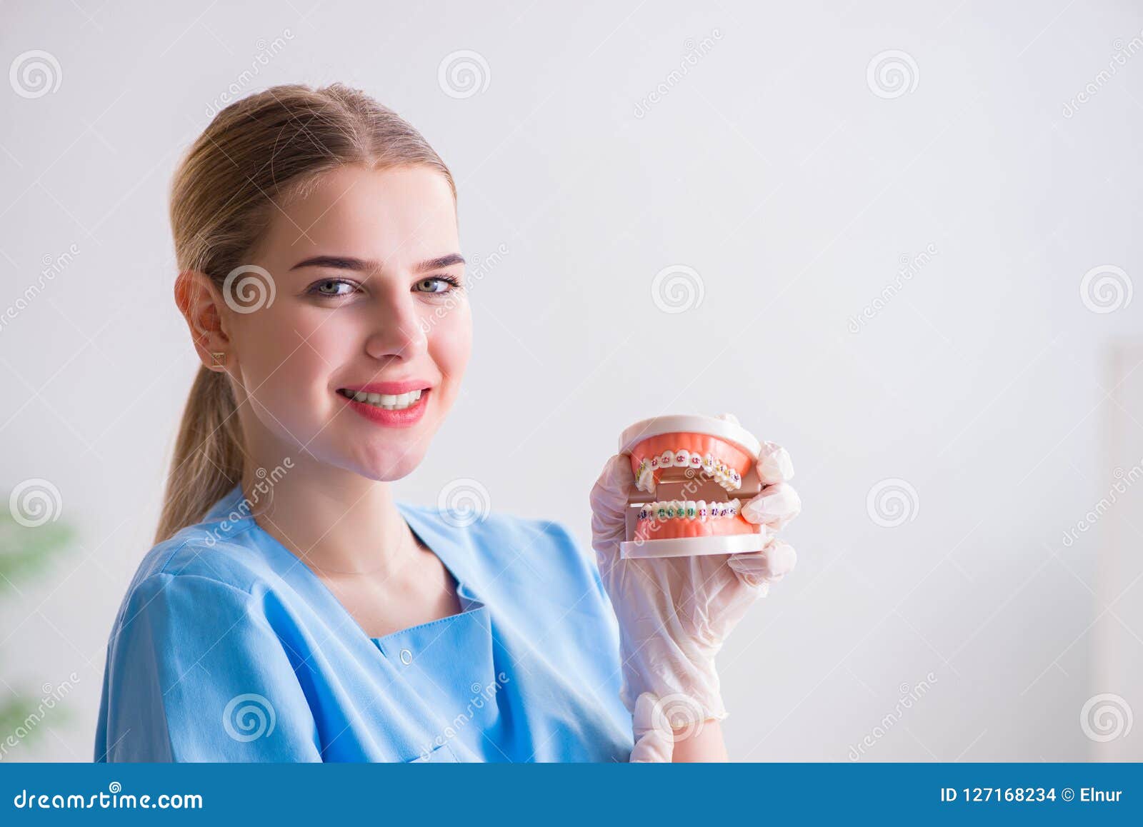 The Young Doctor Nurse with Dentures Stock Photo - Image of implant ...