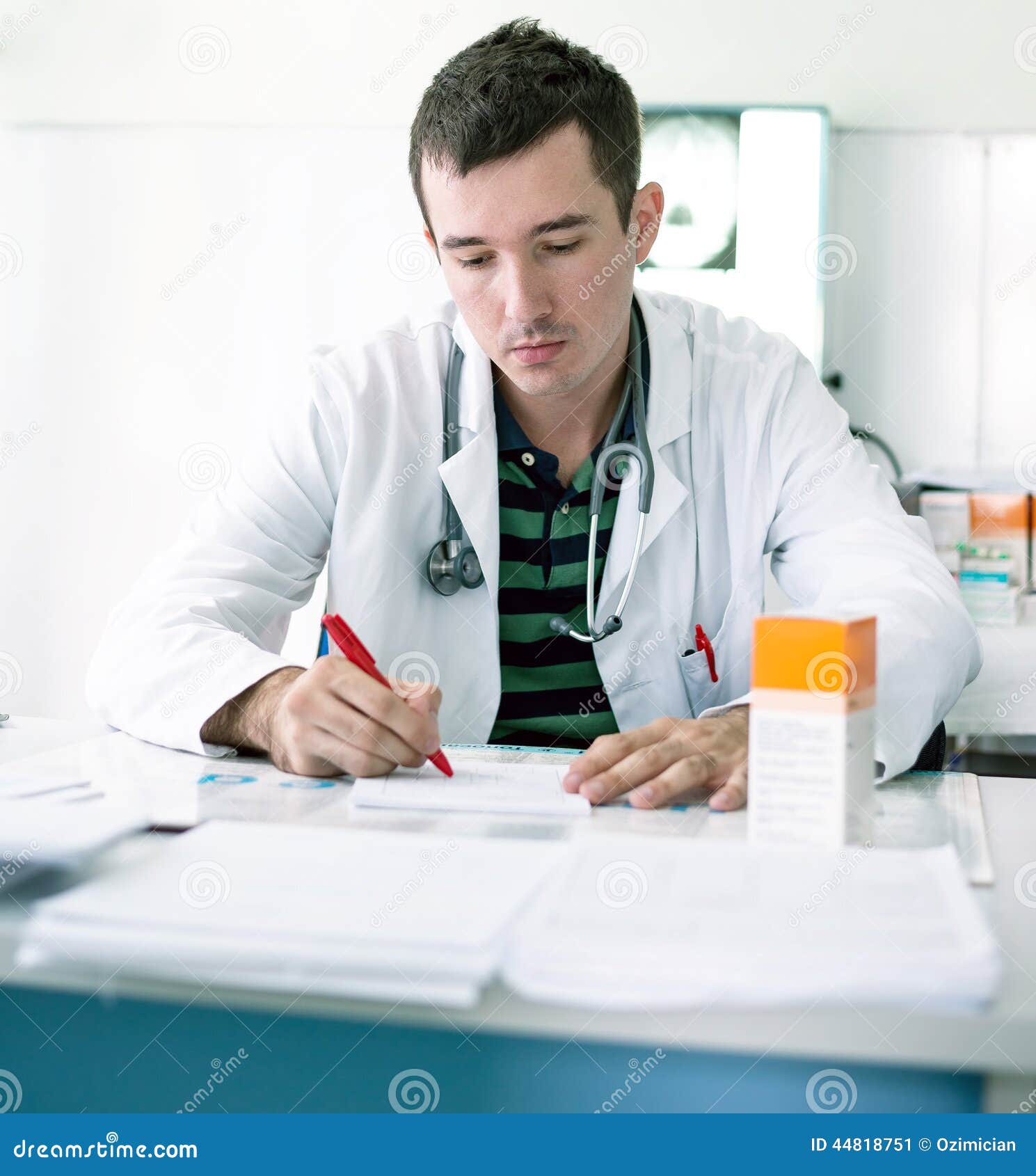 Young Doctor Prescribing Recipe Stock Image - Image of professional ...