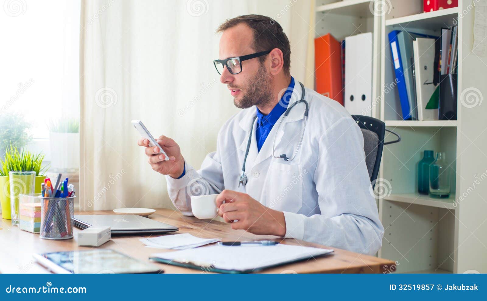 Young Doctor Sitting Behind Desk in His Modern Office. Stock Image ...