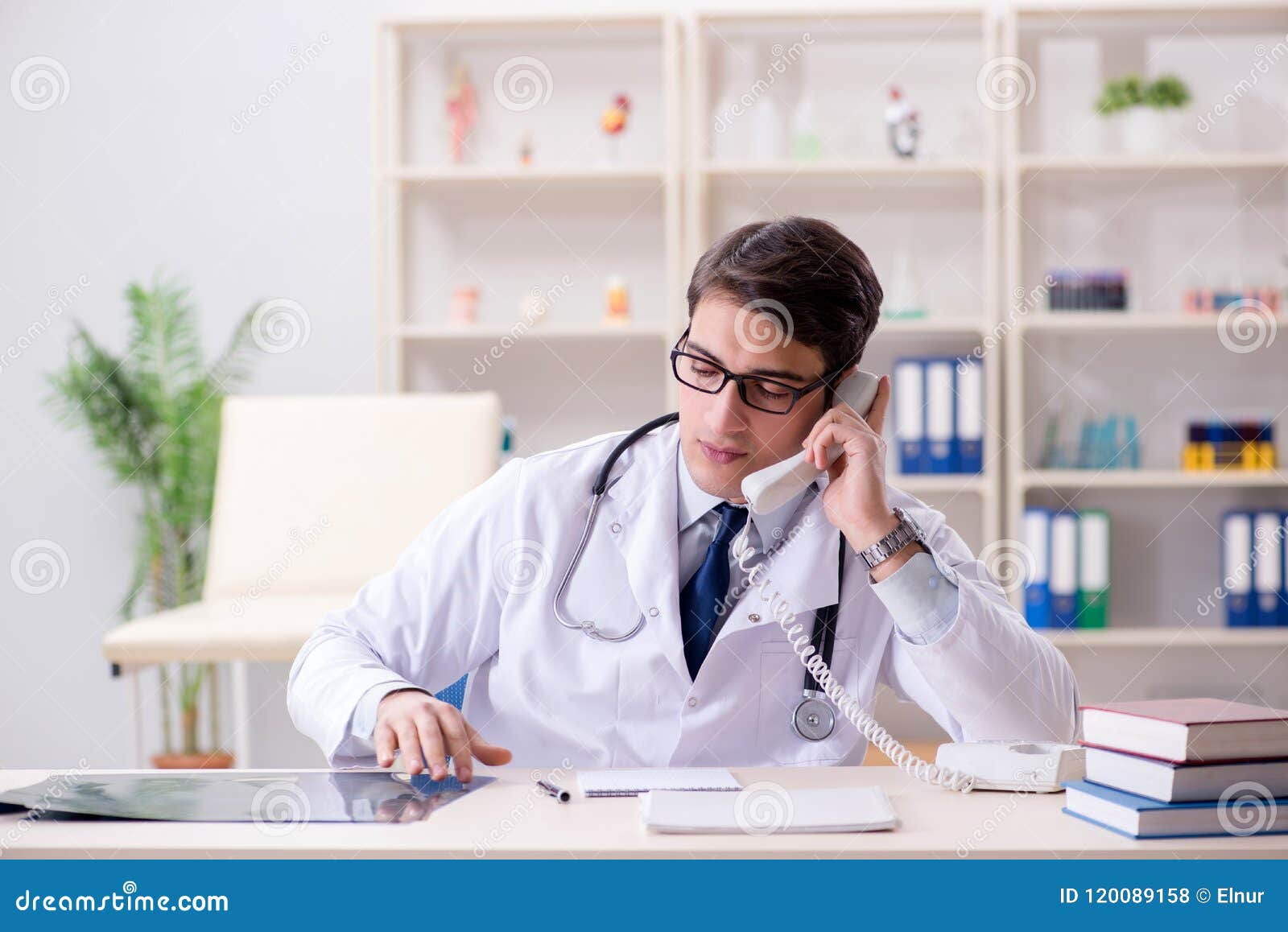 The Young Doctor Sitting in the Office Stock Photo - Image of health ...