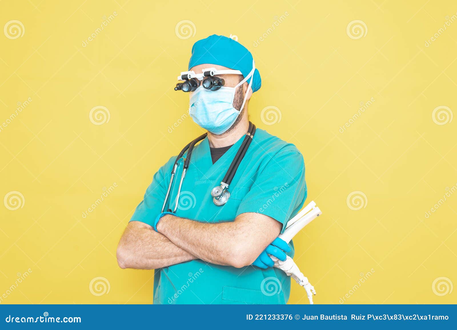Young Doctor-surgeon Dressed in Green on Yellow Background Stock Photo ...